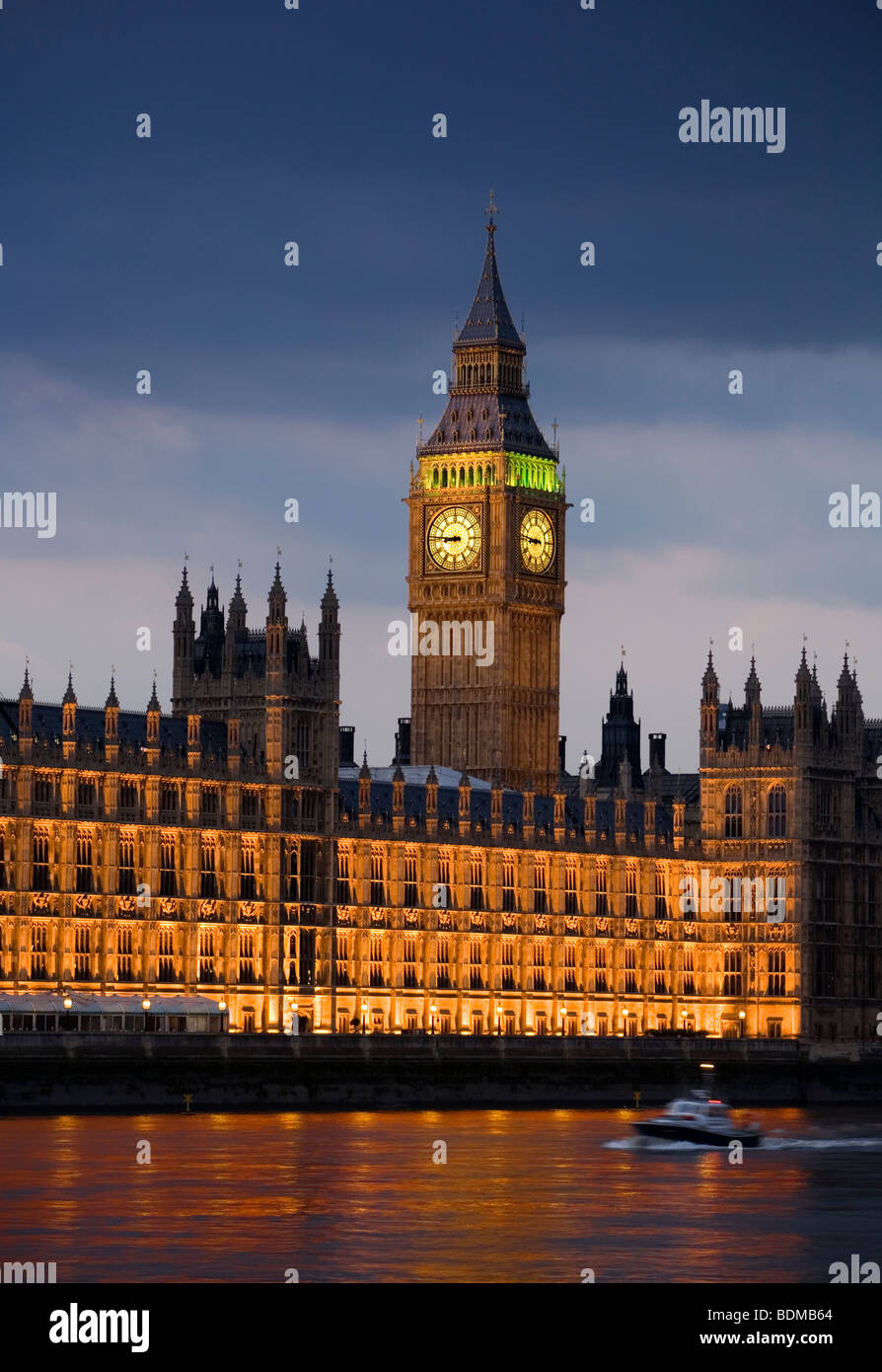 Big Ben clock at dusk. River Thames London, England. Boat passing by ...