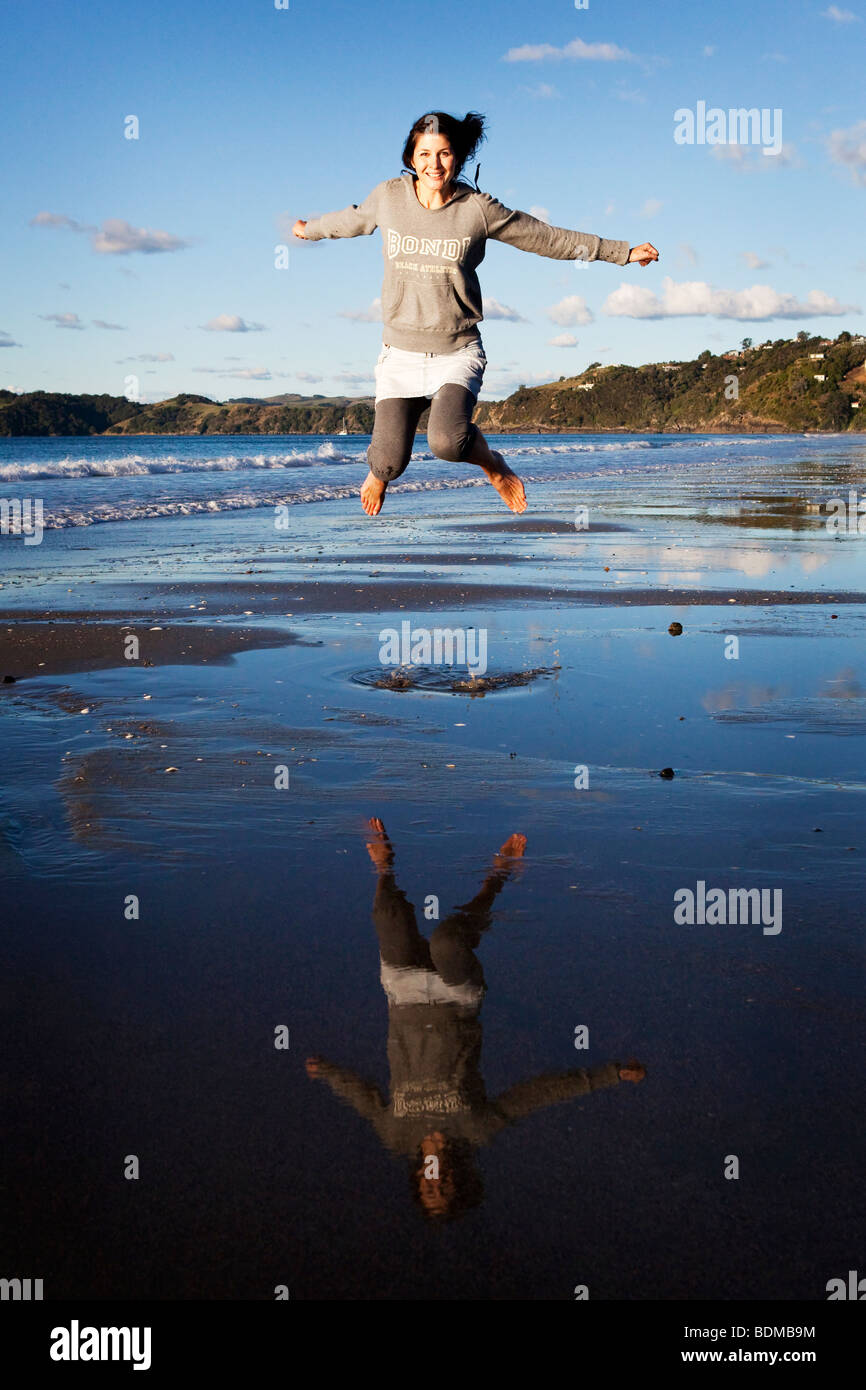 Jumping on a beach hi-res stock photography and images - Alamy