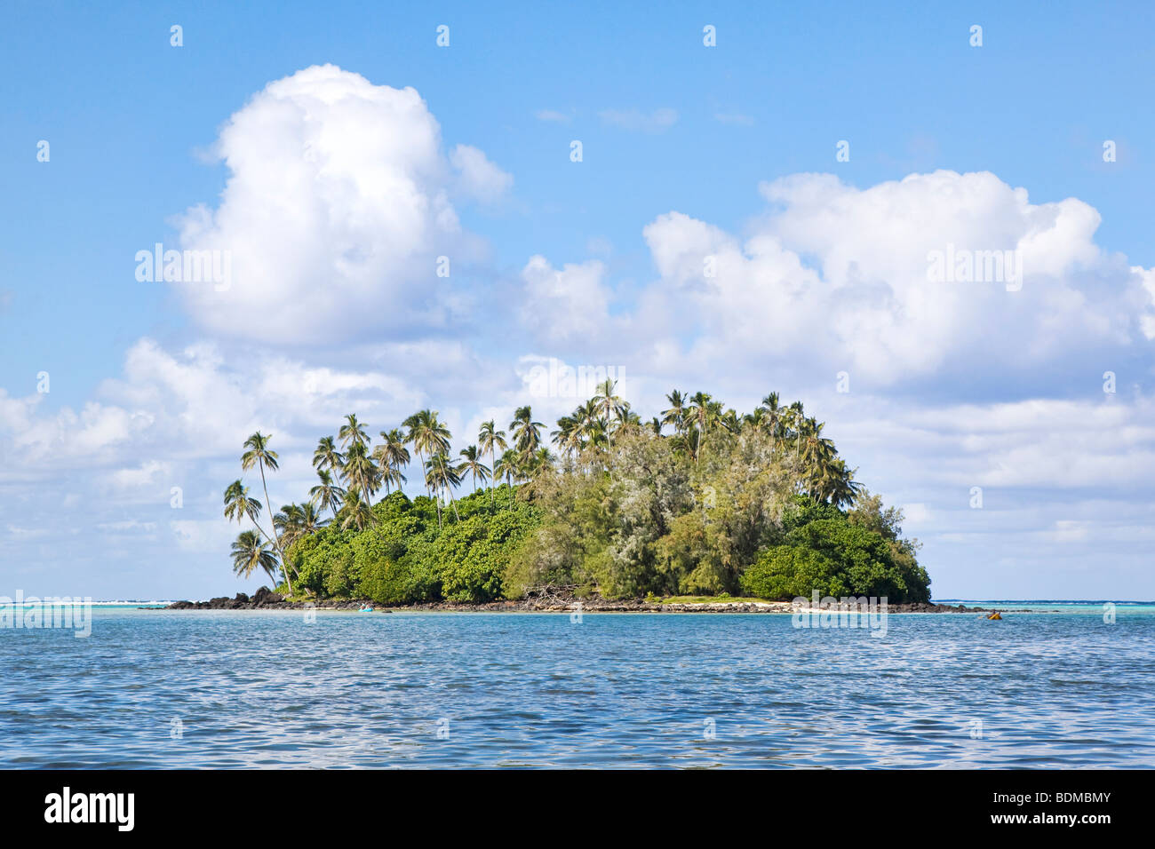 Tropical island on the horizon as seen from Muri Beach on Rarotonga in ...