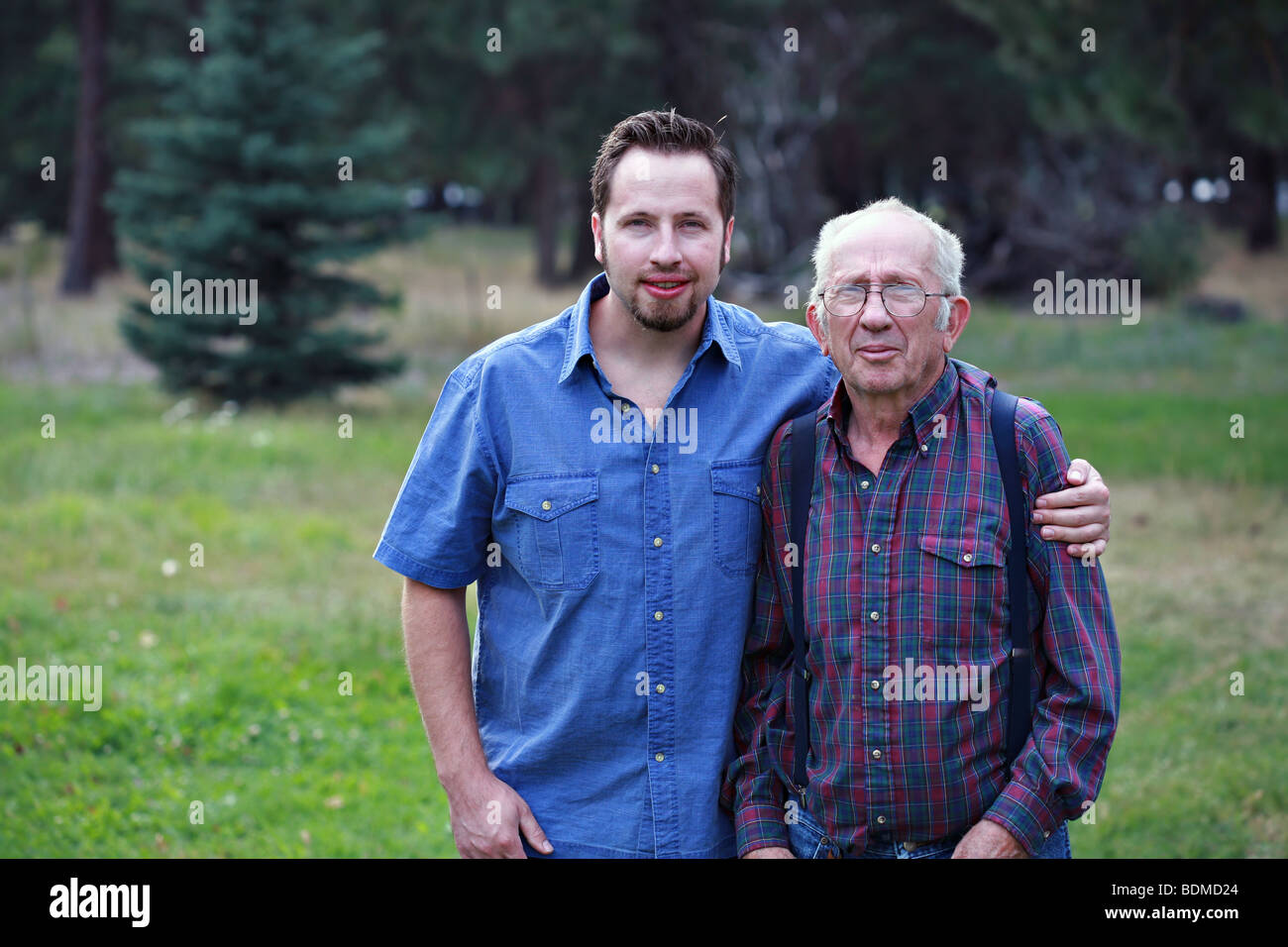 father and son posing, rural setting Stock Photo - Alamy