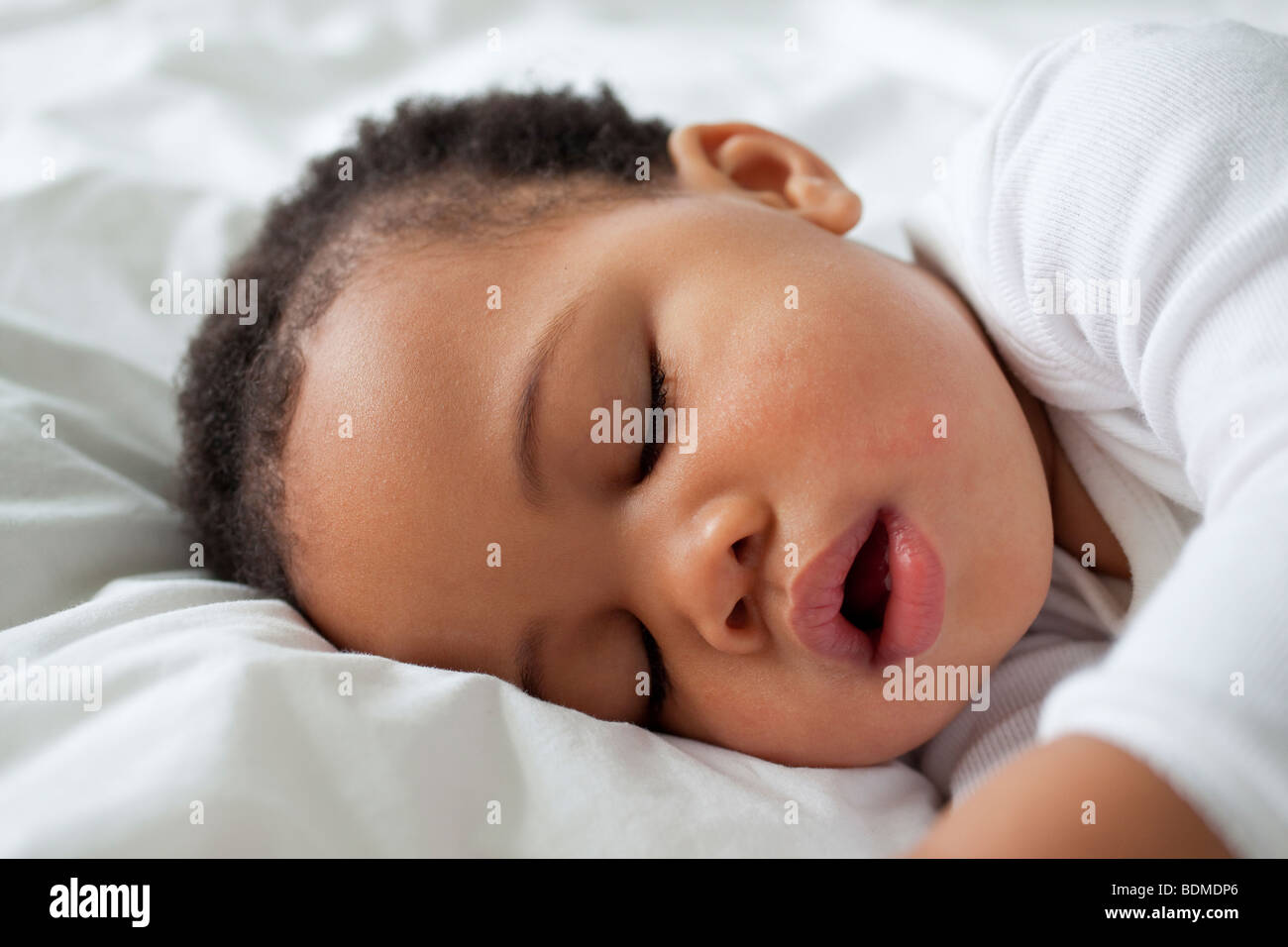 African Baby Sleeping Stock Photo - Alamy