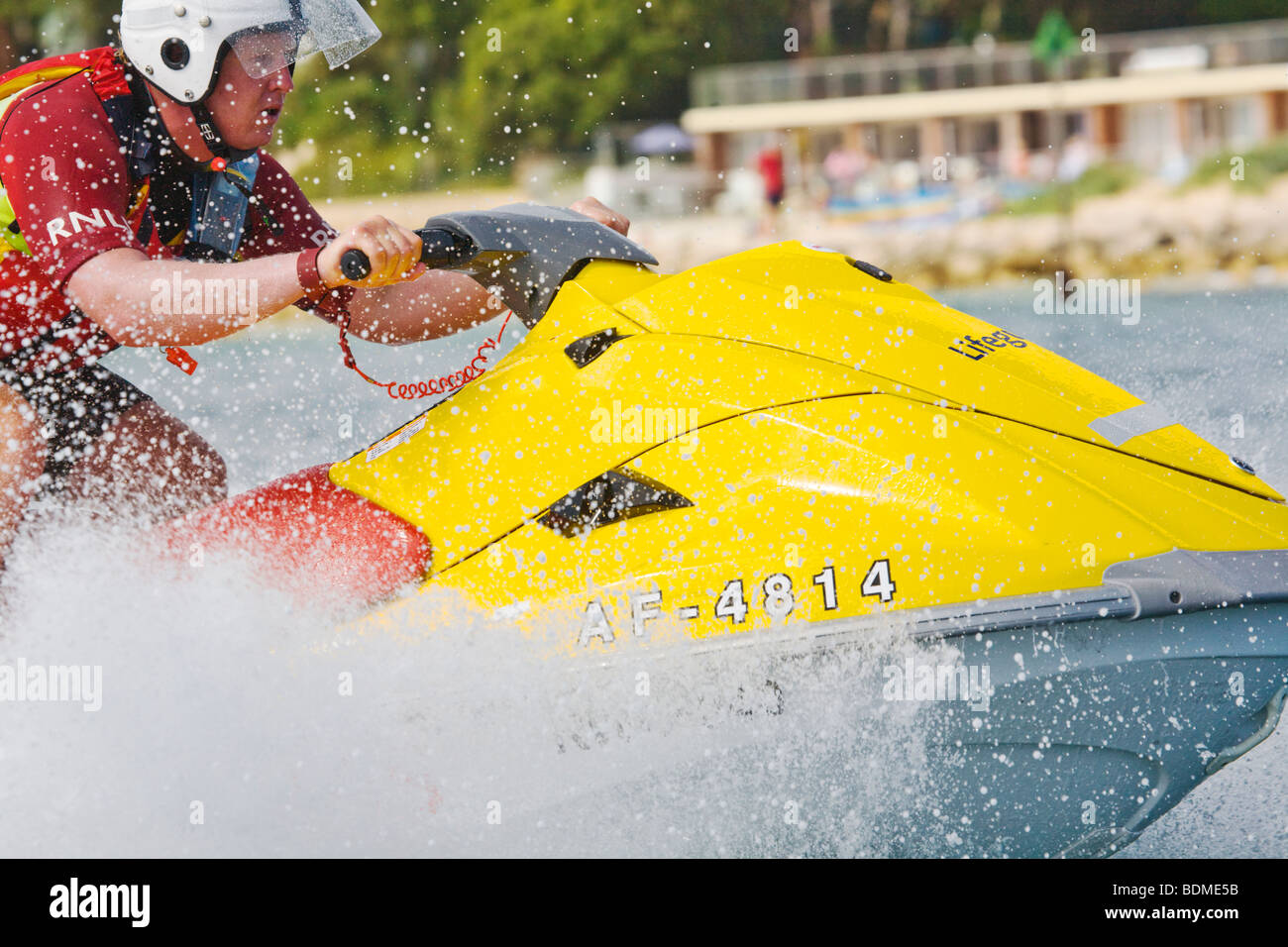 Close up of RNLI lifeguard in action on a Rescue Water Craft (RWC ...