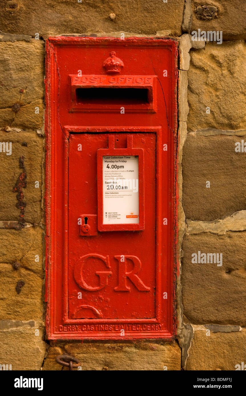 Old red post box close up set into the wall North Yorkshire England UK ...