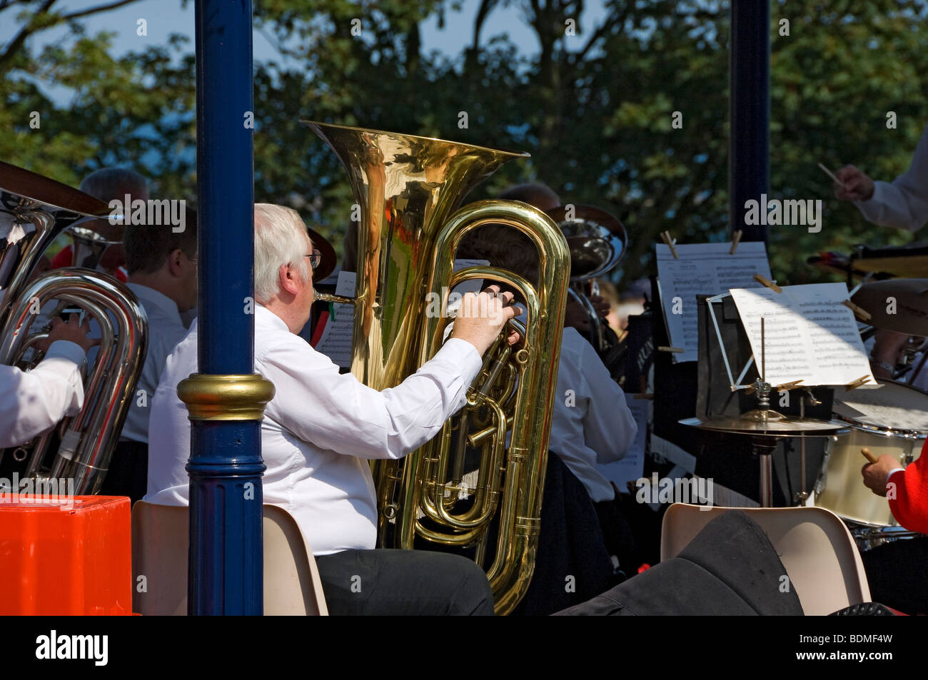 Musician man playing the tuba in the bandstand in summer Crescent ...