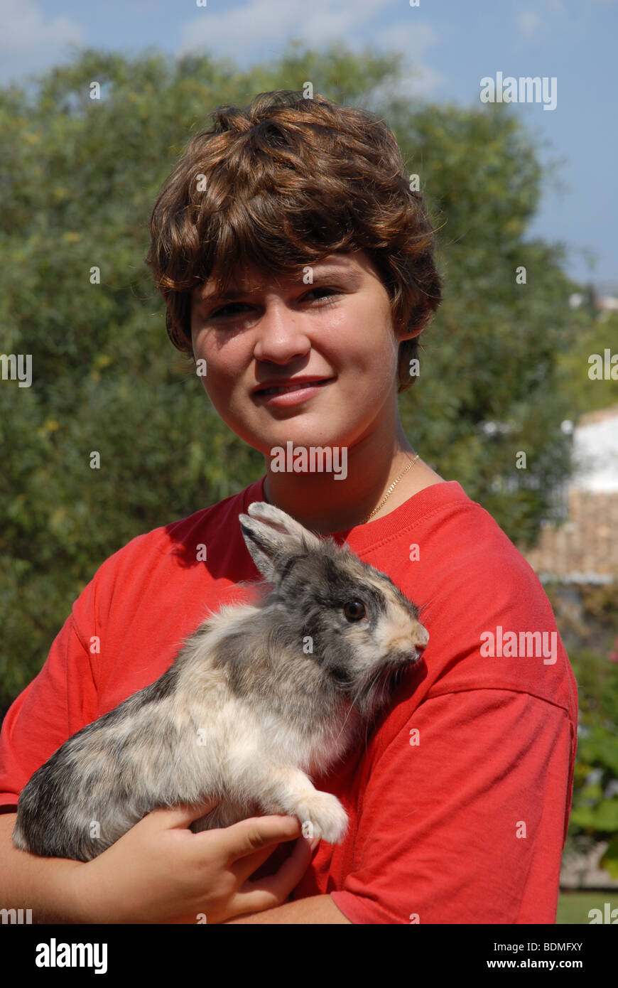 young girl, (age 10) with pet rabbit, outdoors Stock Photo - Alamy