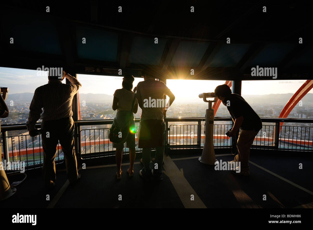 Visitors and sunset lights. Observation deck of Kyoto Tower. Kyoto ...
