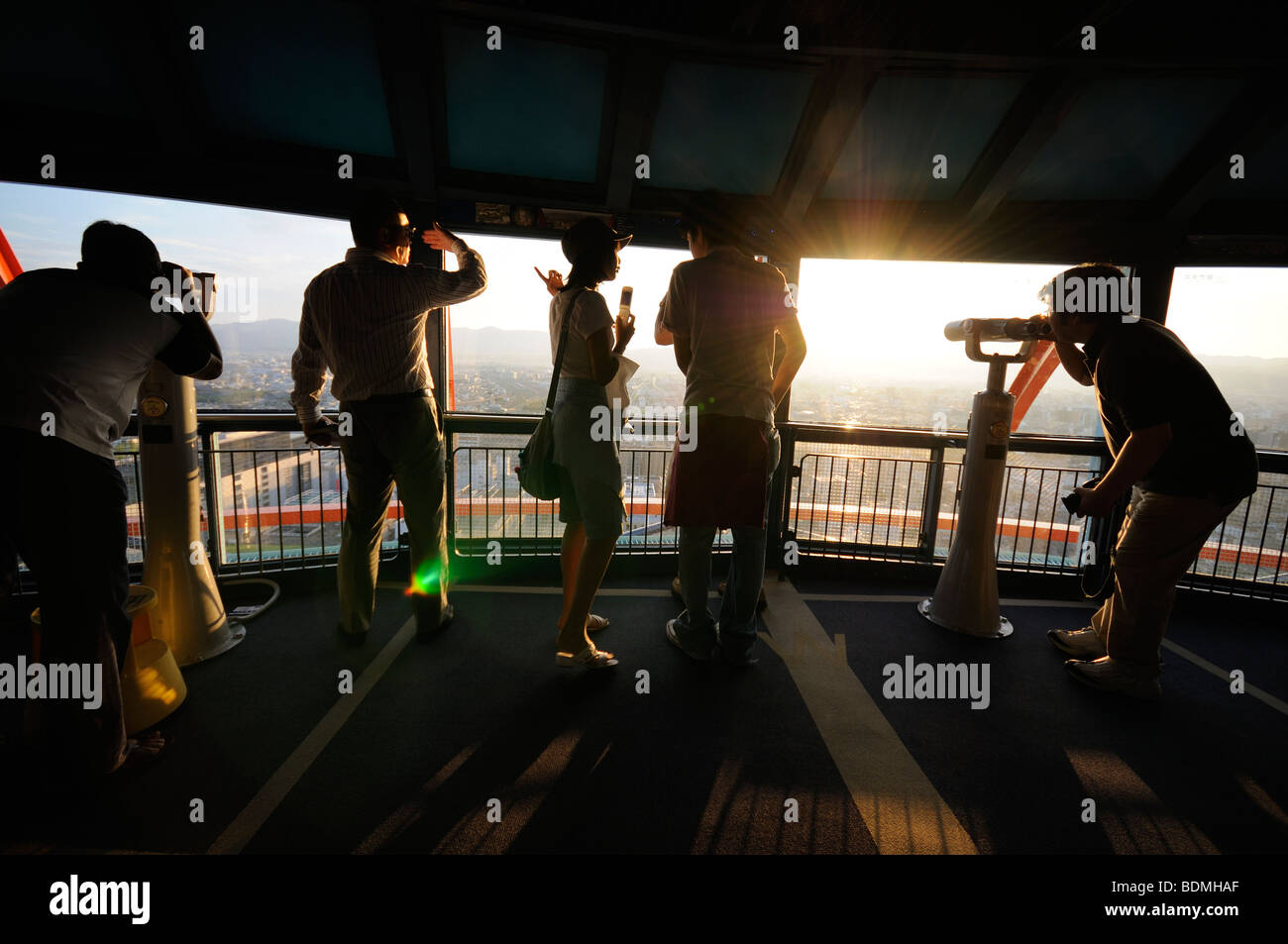 Visitors and sunset lights. Observation deck of Kyoto Tower. Kyoto ...