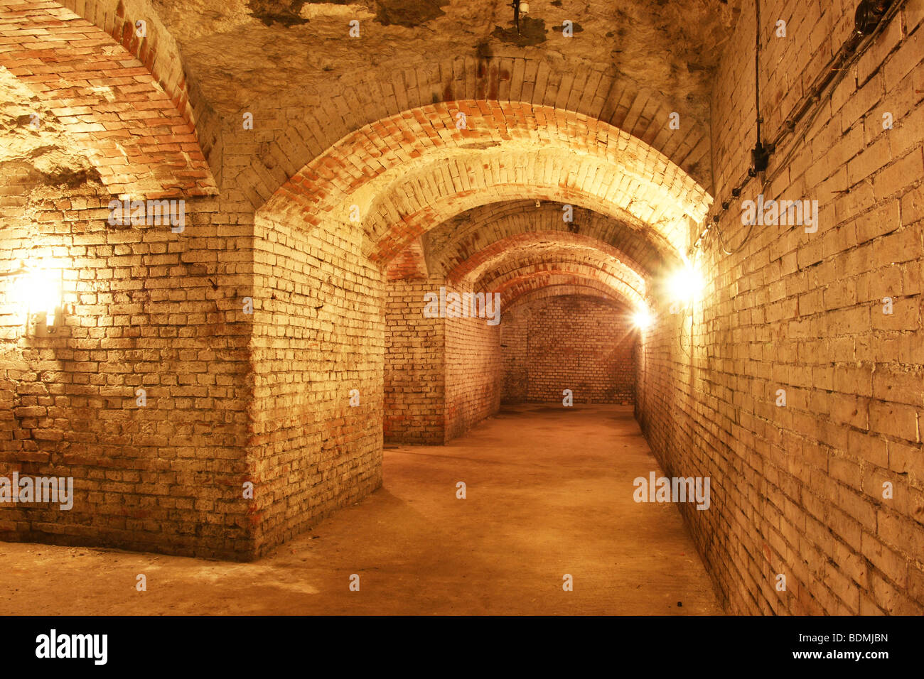 Ancient dungeon carved into a rock and later bricked Stock Photo - Alamy