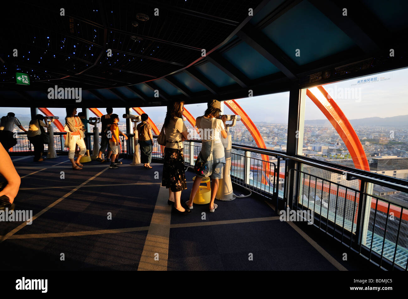 Visitors and sunset lights. Observation deck of Kyoto Tower. Kyoto ...