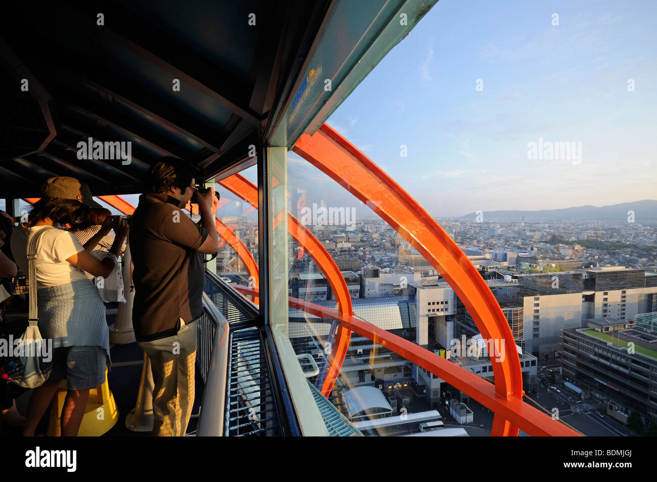 Visitors and sunset lights. Observation deck of Kyoto Tower. Kyoto ...