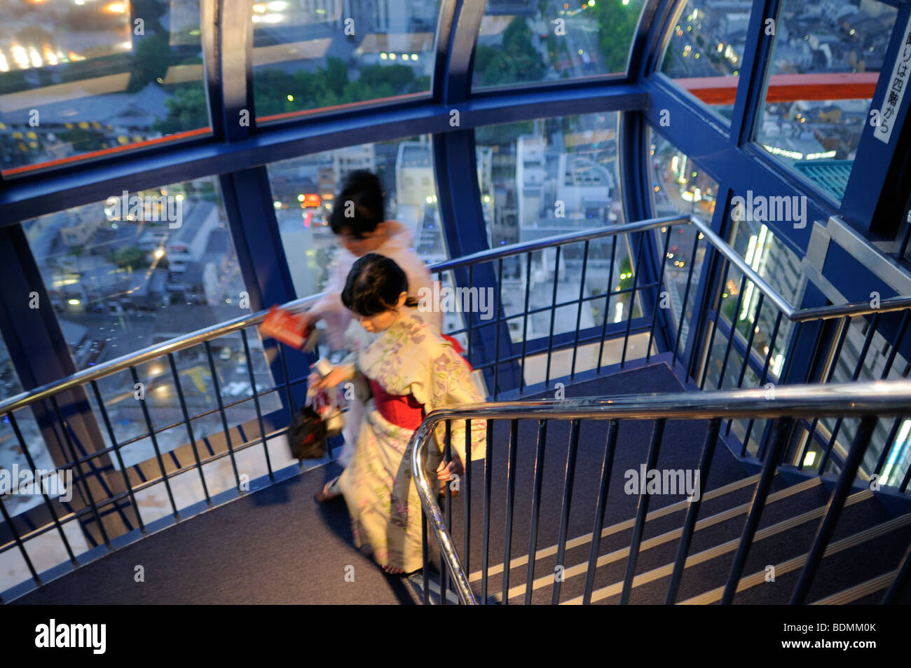 Women in yukata (summer kimono) going downstairs. Observation deck of ...