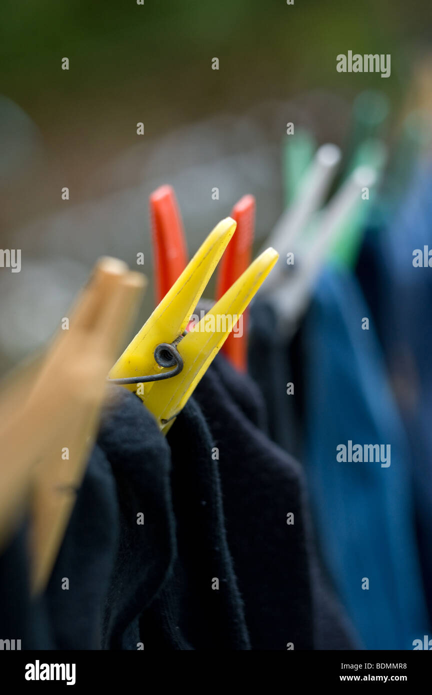 clothes hanging on linen line secured by clothes pegs Stock Photo - Alamy