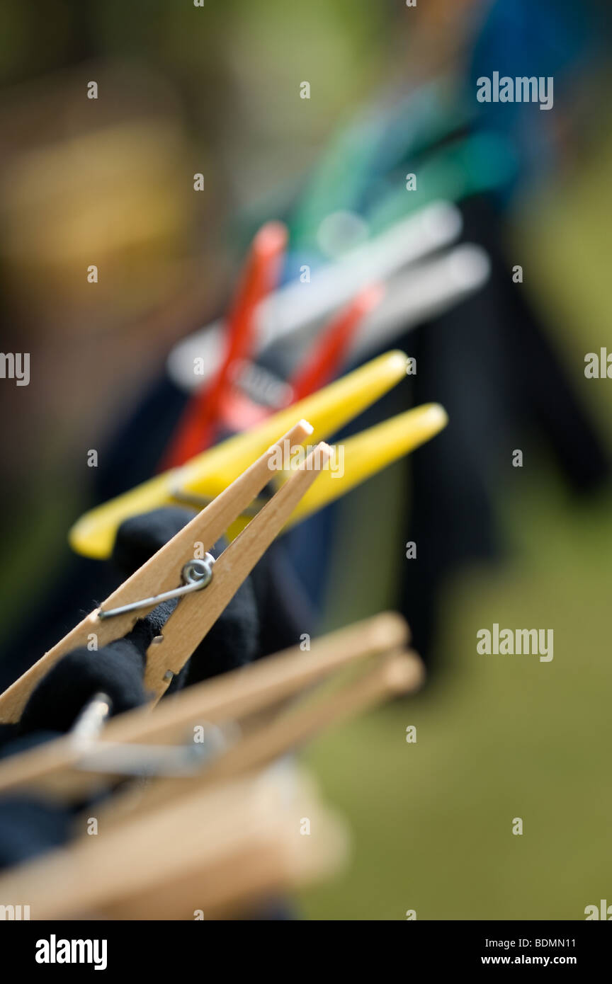 clothes pegs attached to washing line Stock Photo - Alamy
