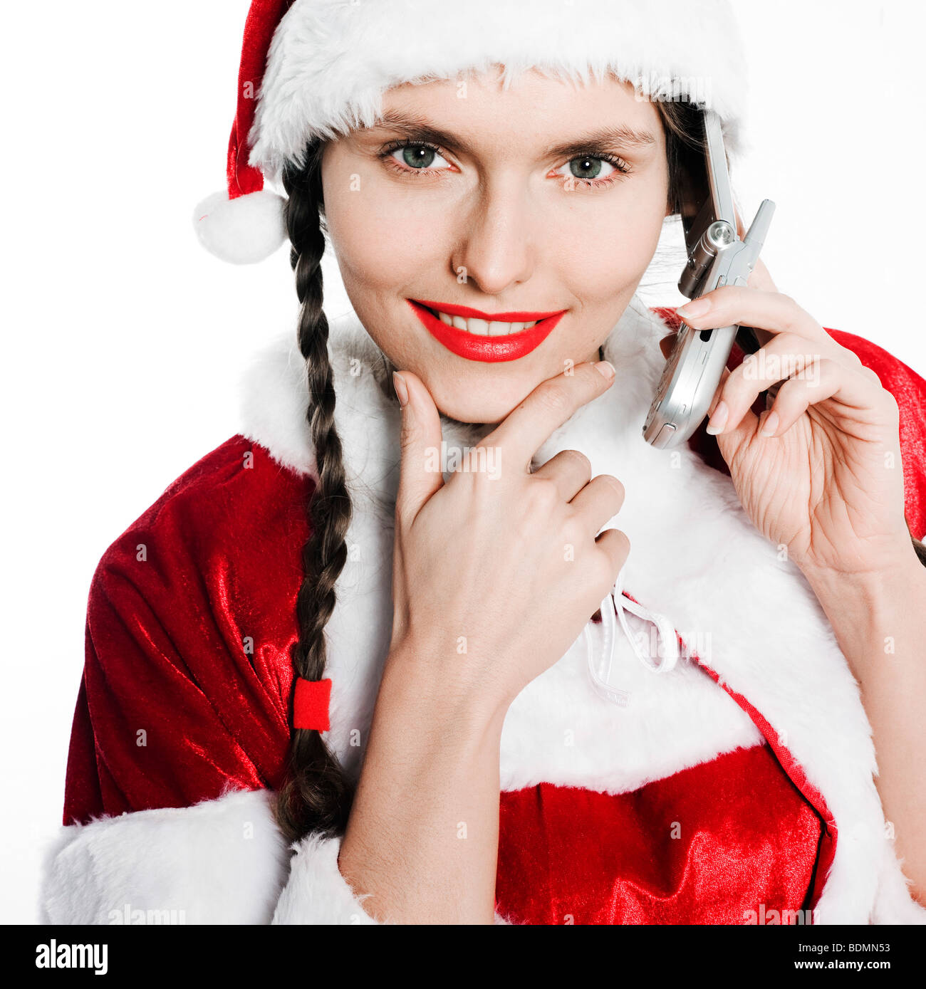 young funny and expressive woman dressed as santa claus is doing her ...