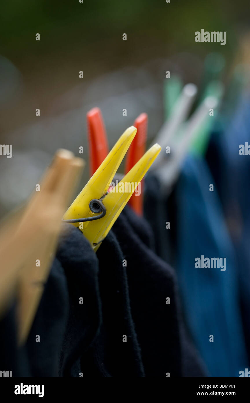 washing pegged on to linen line with plastic clothes pegs Stock Photo ...