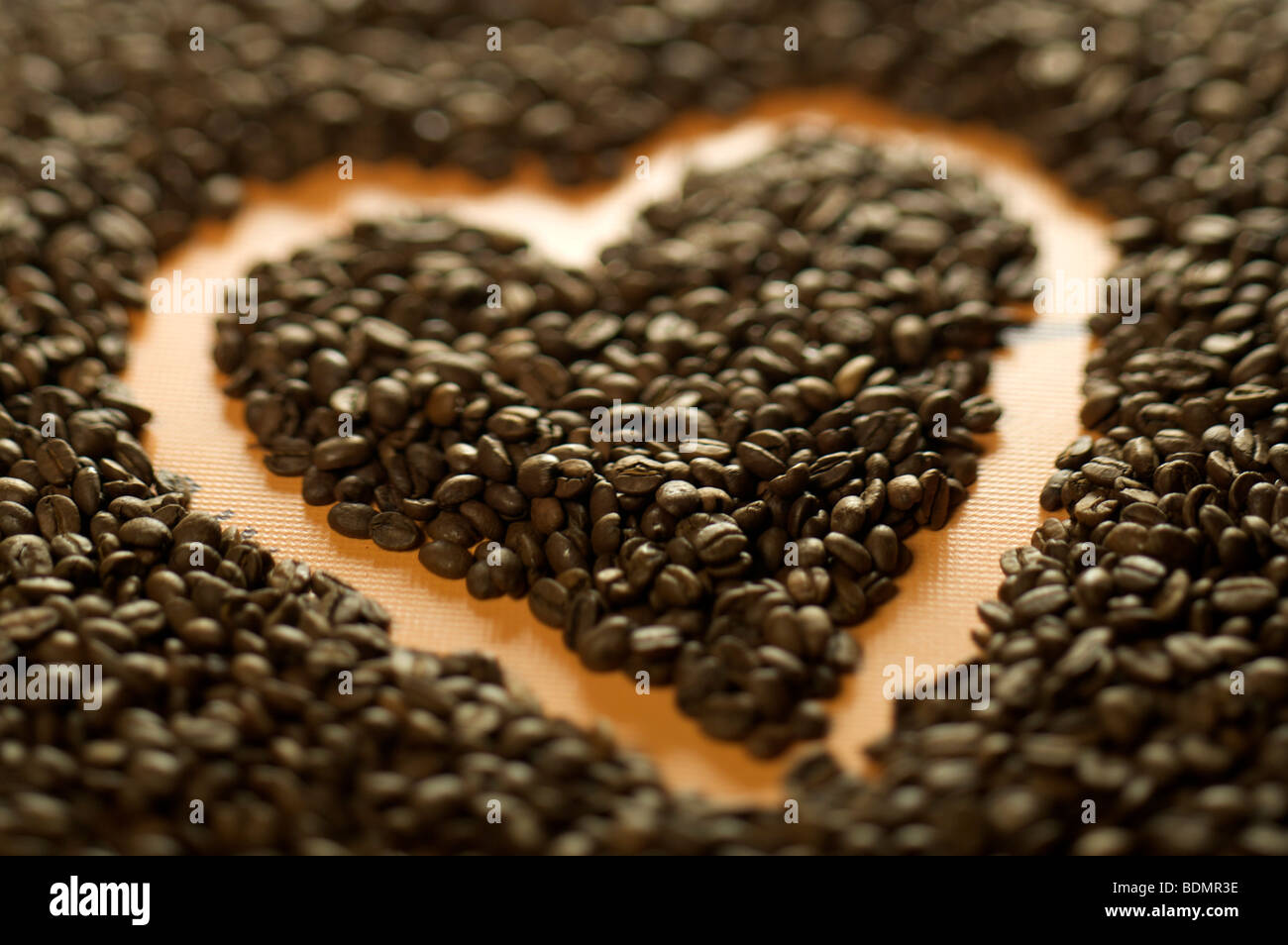 Coffee beans in heart shape Stock Photo - Alamy