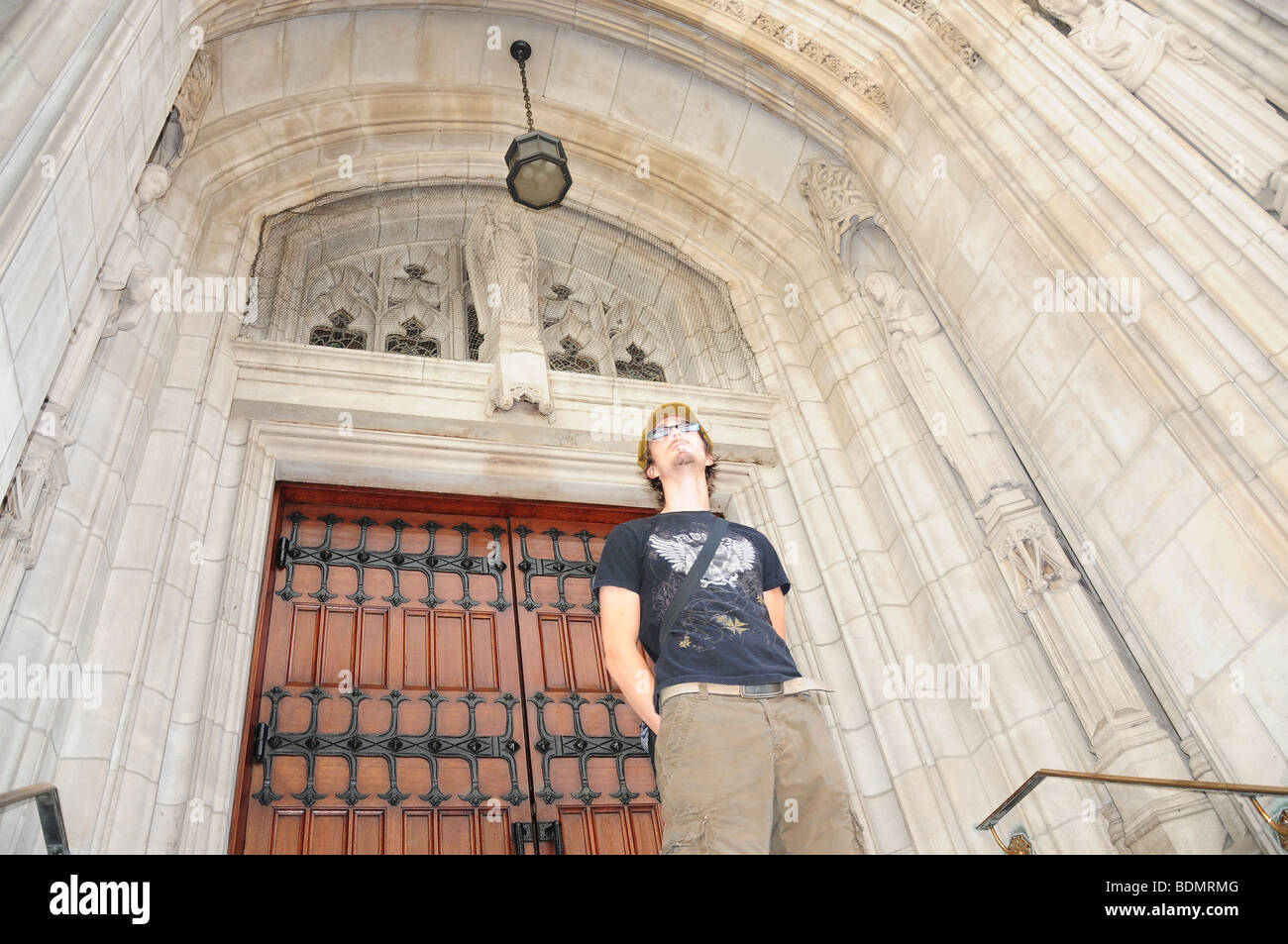 Man standing in front of building in New York Stock Photo - Alamy