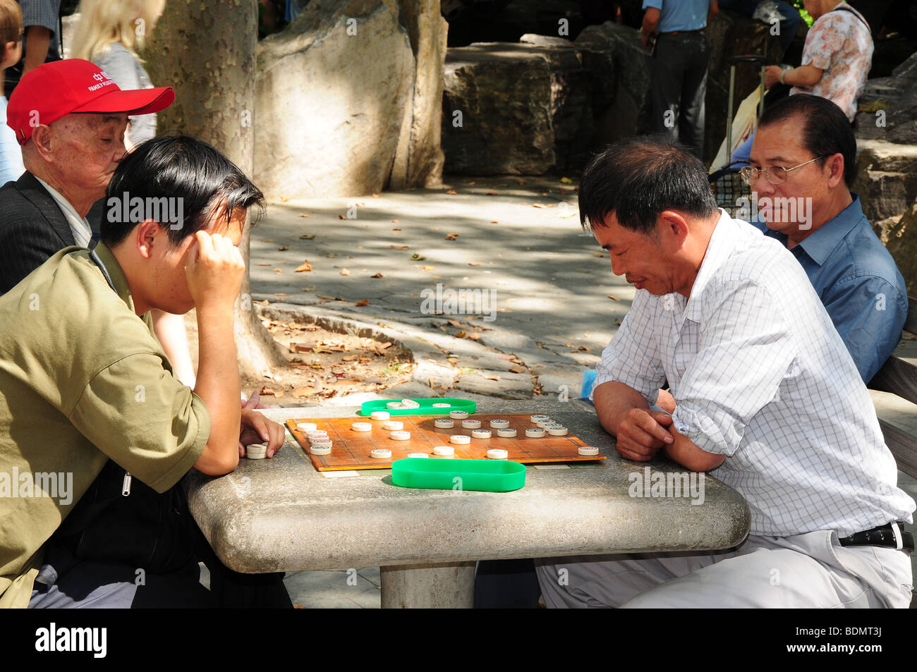 Chinatown two men playing a board game outside Stock Photo - Alamy
