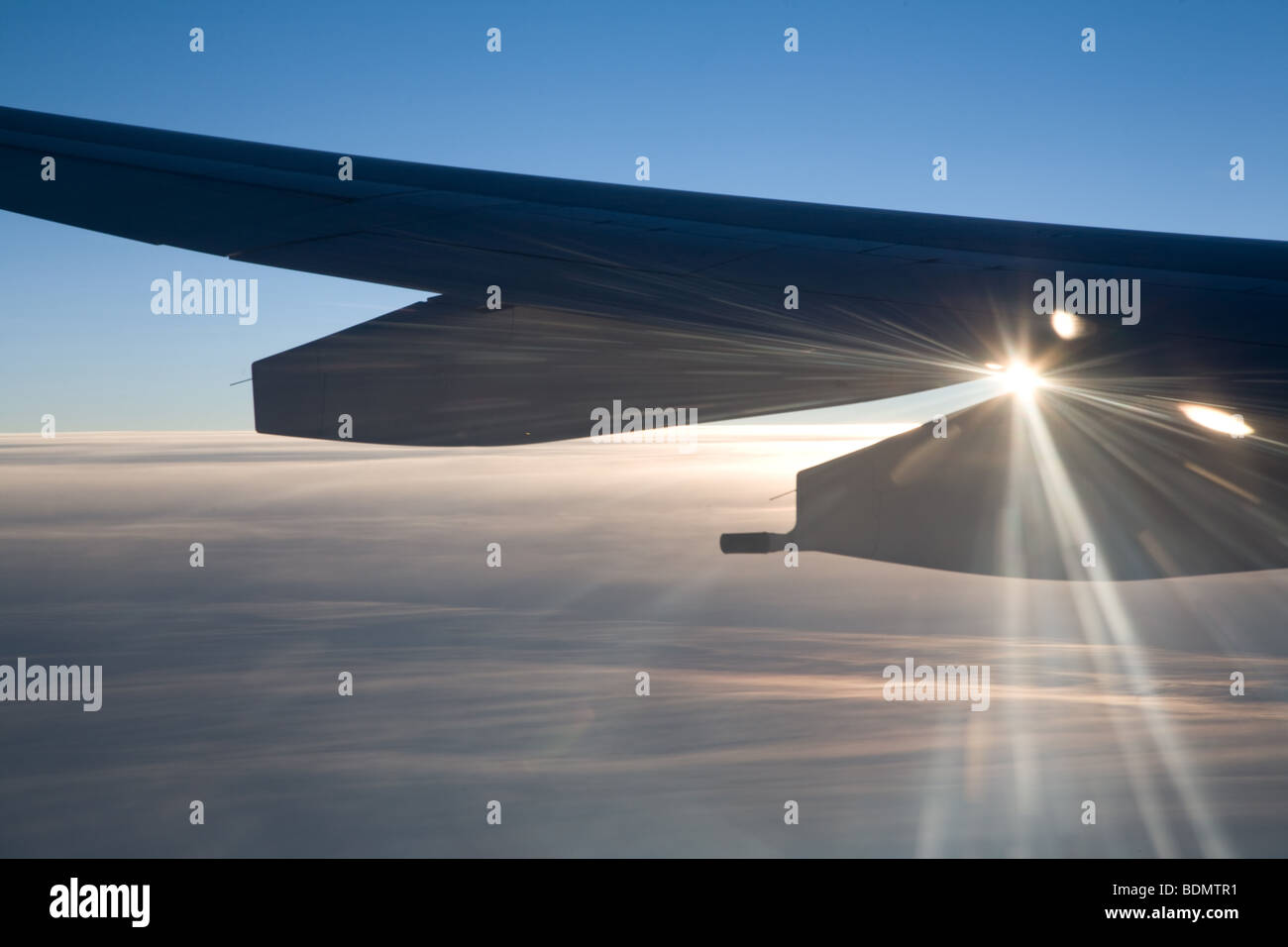 airplane wing at night dusk sunburst sunset plane Stock Photo - Alamy