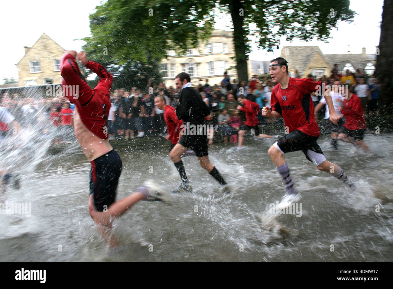 The annual football match held in The River Windrush Bourton on the ...