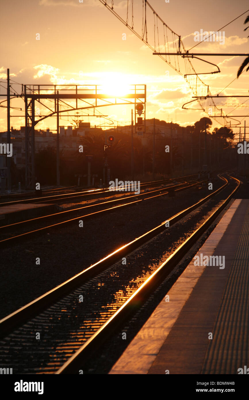 empty train station platform at sunset Stock Photo - Alamy