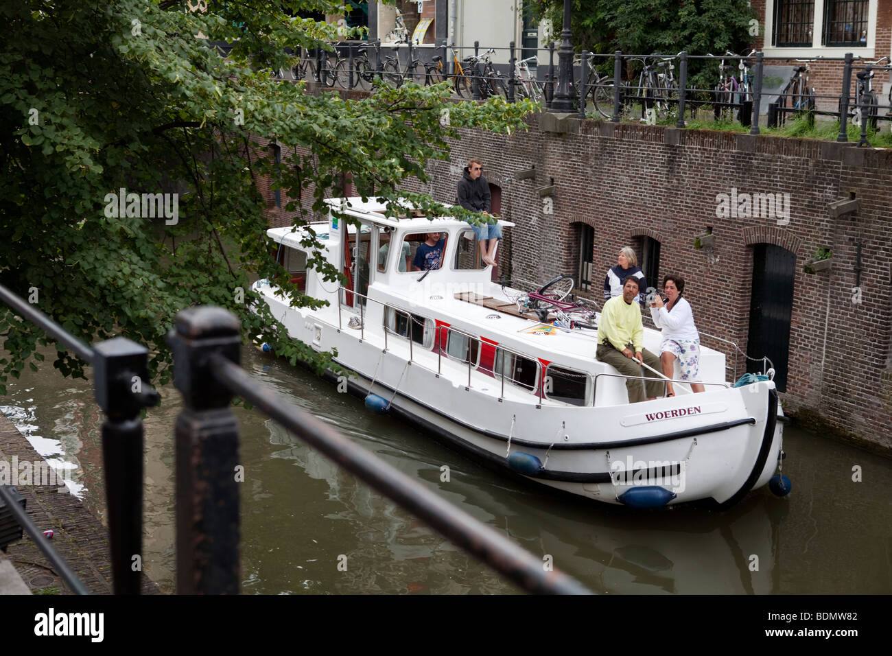 TOURISTS VISITING UTRECHT BY BOAT . HOLLAND Stock Photo - Alamy