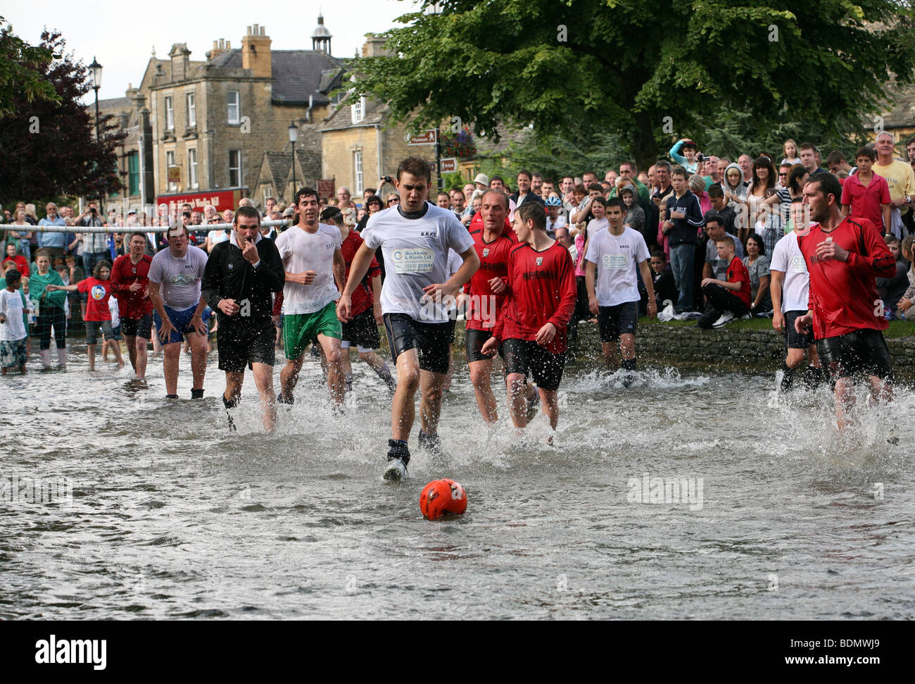 The annual football match held in The River Windrush Bourton on the ...