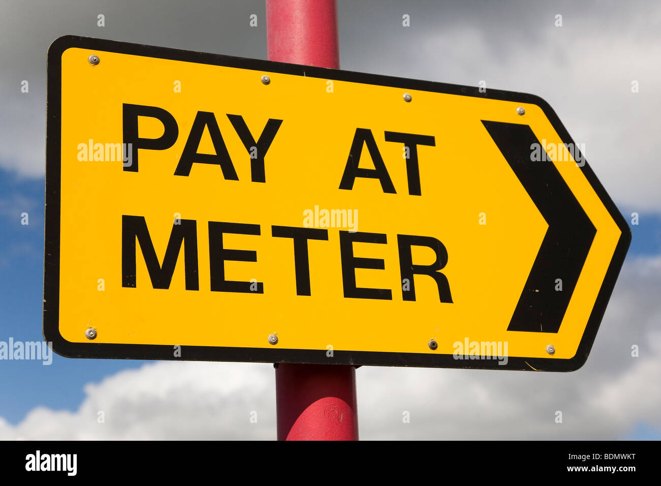 A yellow "Pay At Meter" sign in the North Yorkshire town of Whitby ...