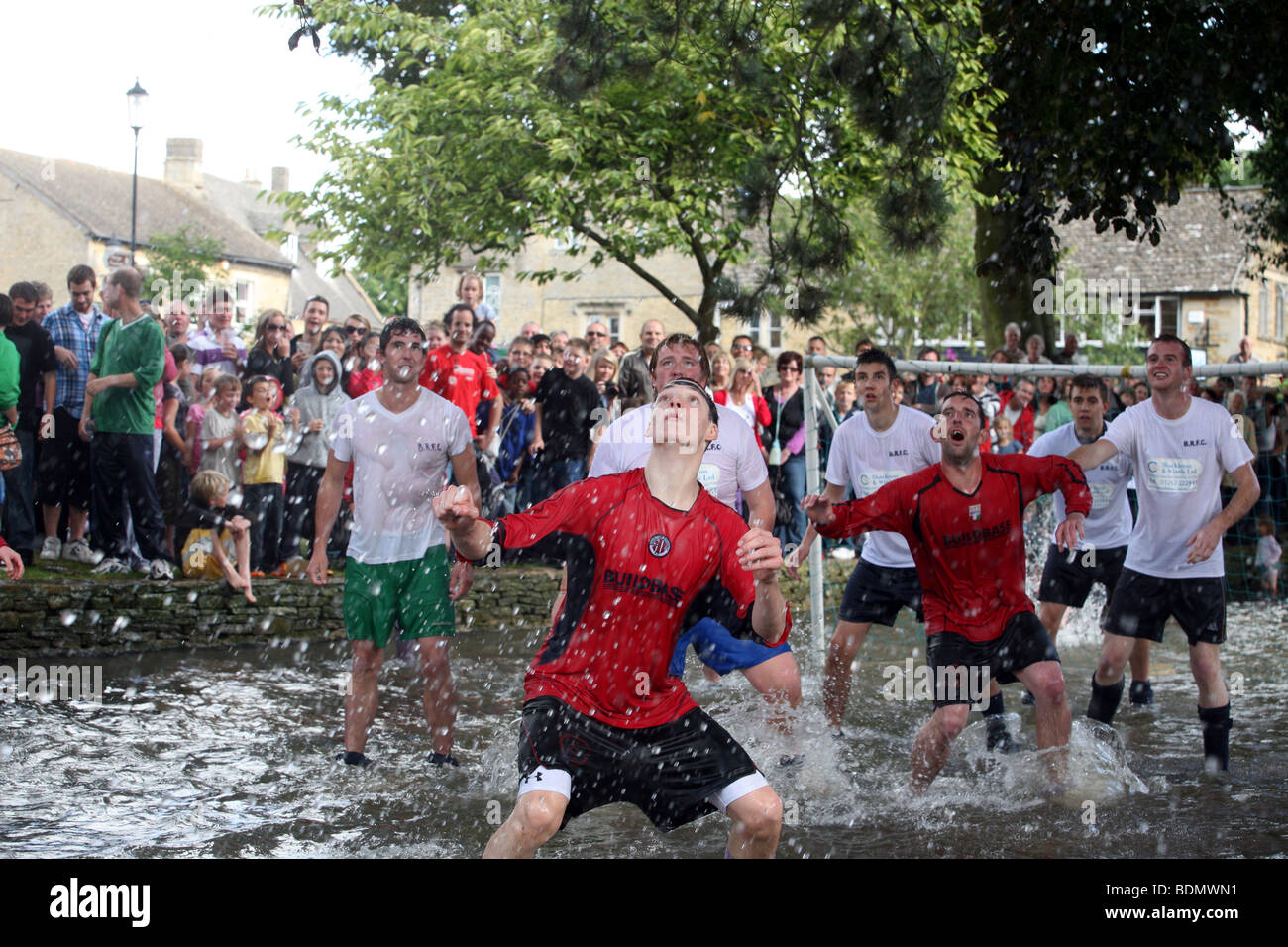 The annual football match held in The River Windrush Bourton on the ...