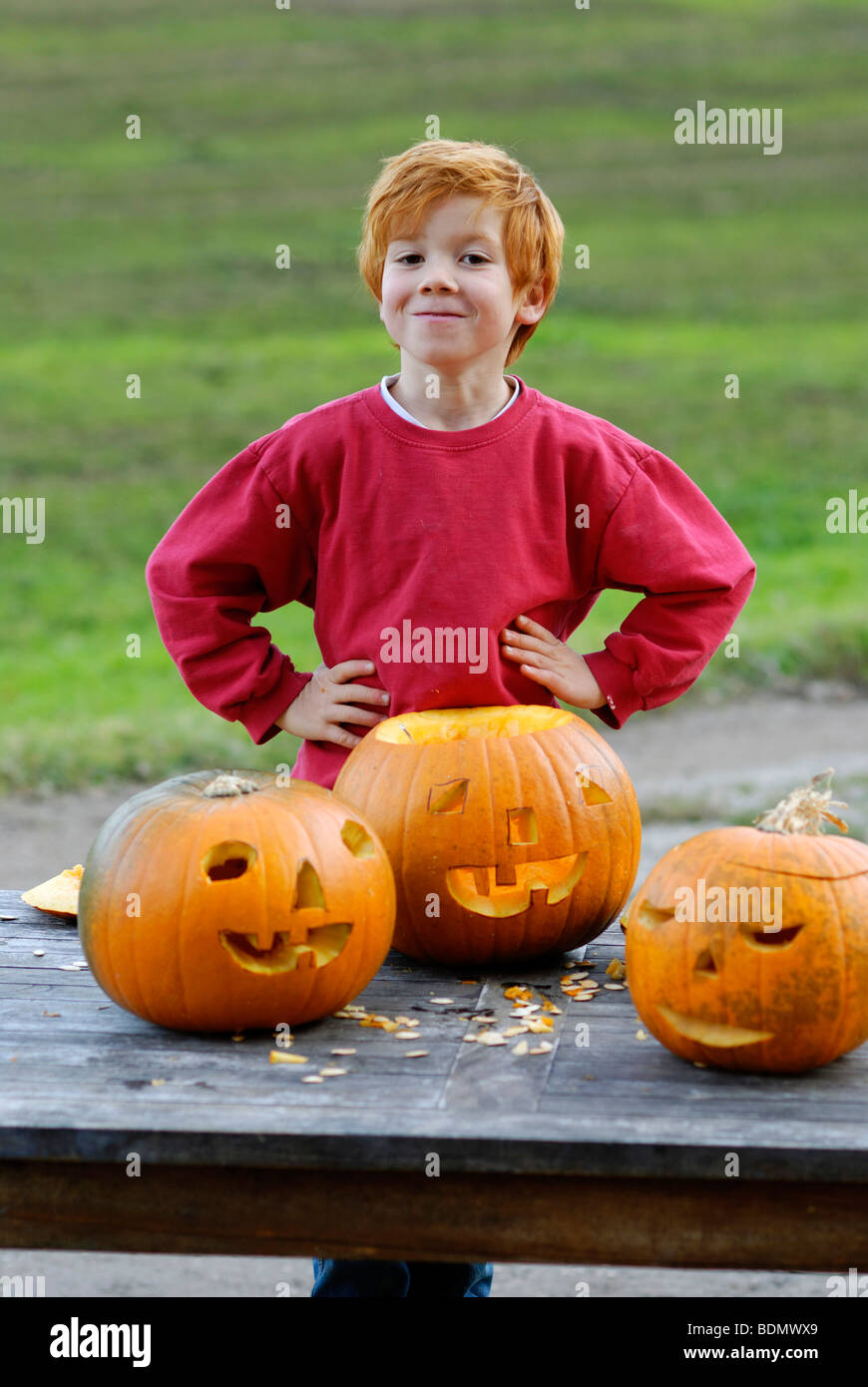 Boy carving a jack-o-lantern from a pumpkin for Halloween Stock Photo ...