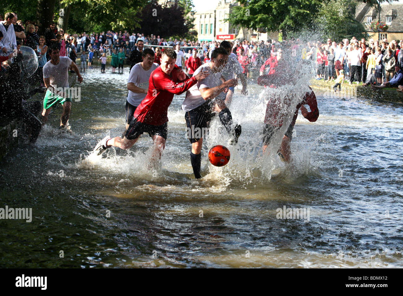 The annual football match held in The River Windrush Bourton on the ...