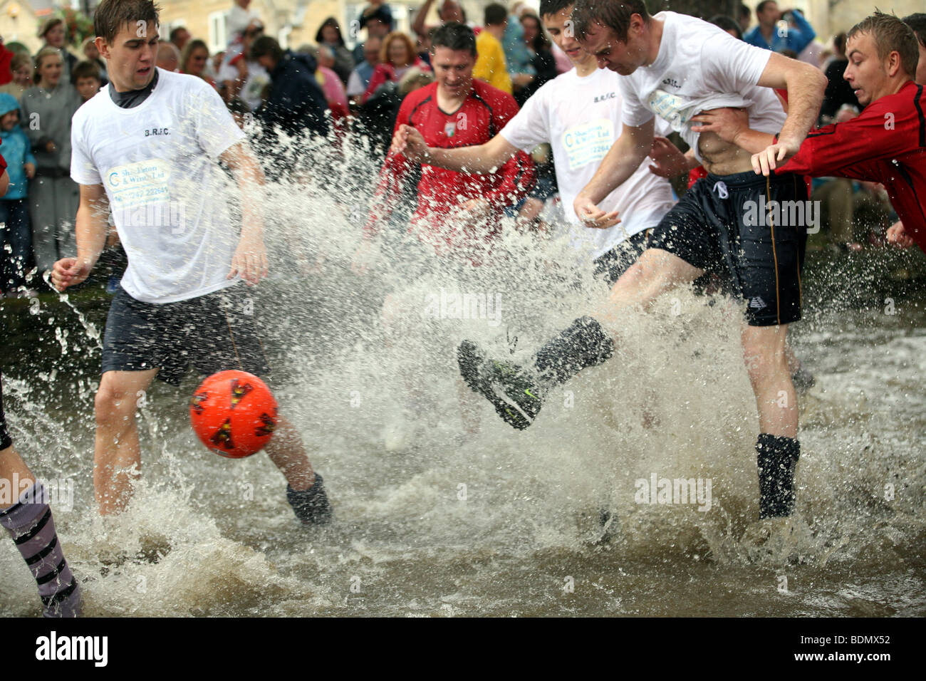 The annual football match held in The River Windrush Bourton on the ...