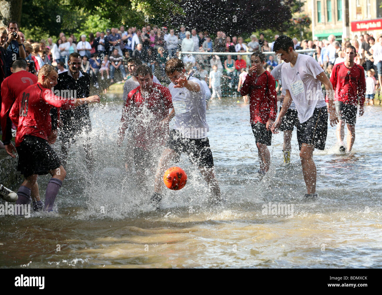 The annual football match held in The River Windrush Bourton on the ...