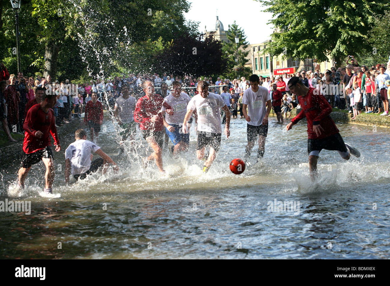 The annual football match held in The River Windrush Bourton on the ...