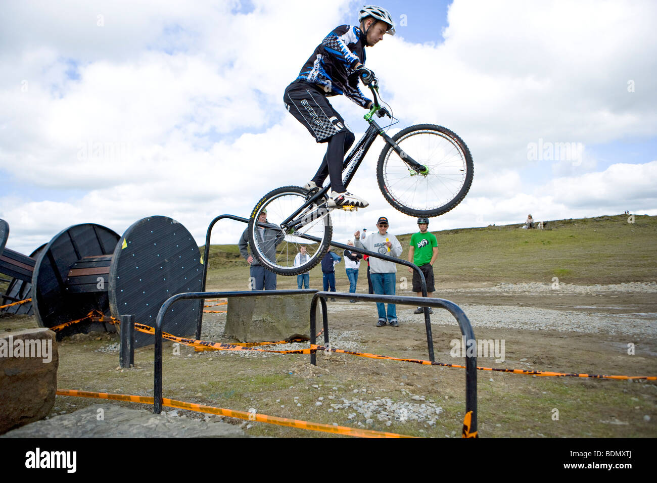 Trial cyclists competing on a quarry Stock Photo - Alamy