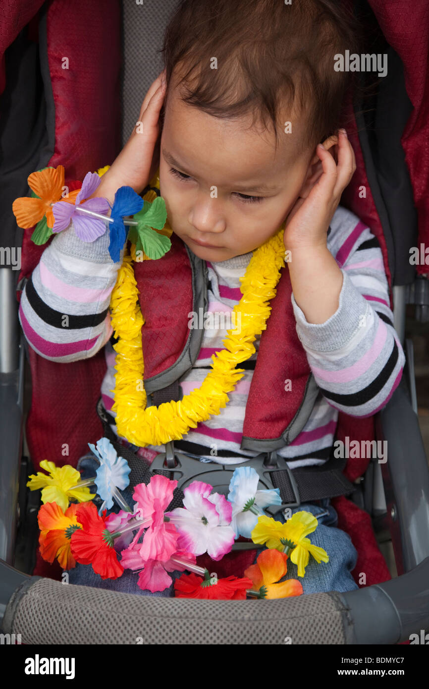 Notting Hill Carnival Parade 2009 - young child covering ears because ...