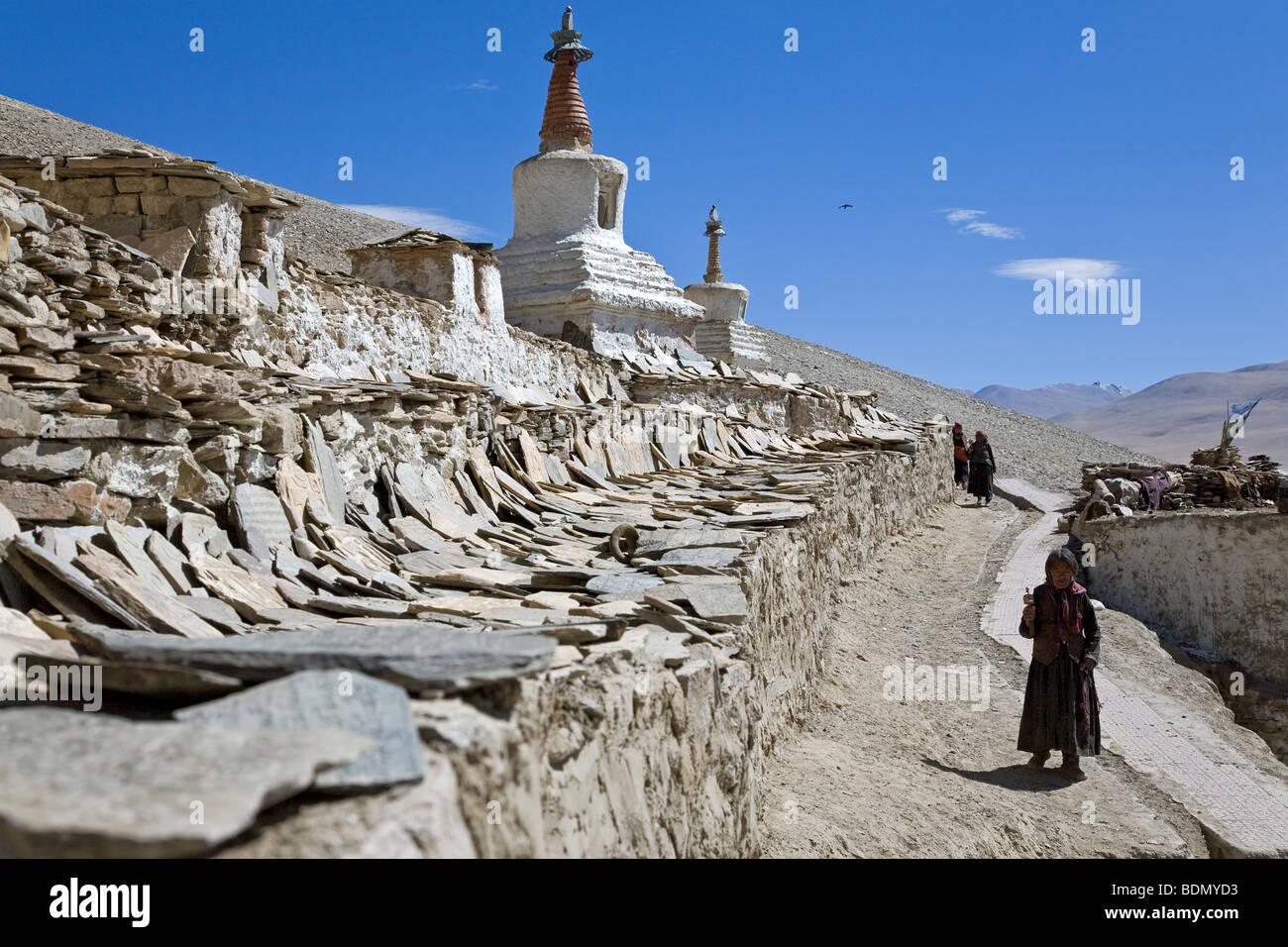 Ladakhi women circumambulating a prayer wall. Korzok village. Ladakh ...