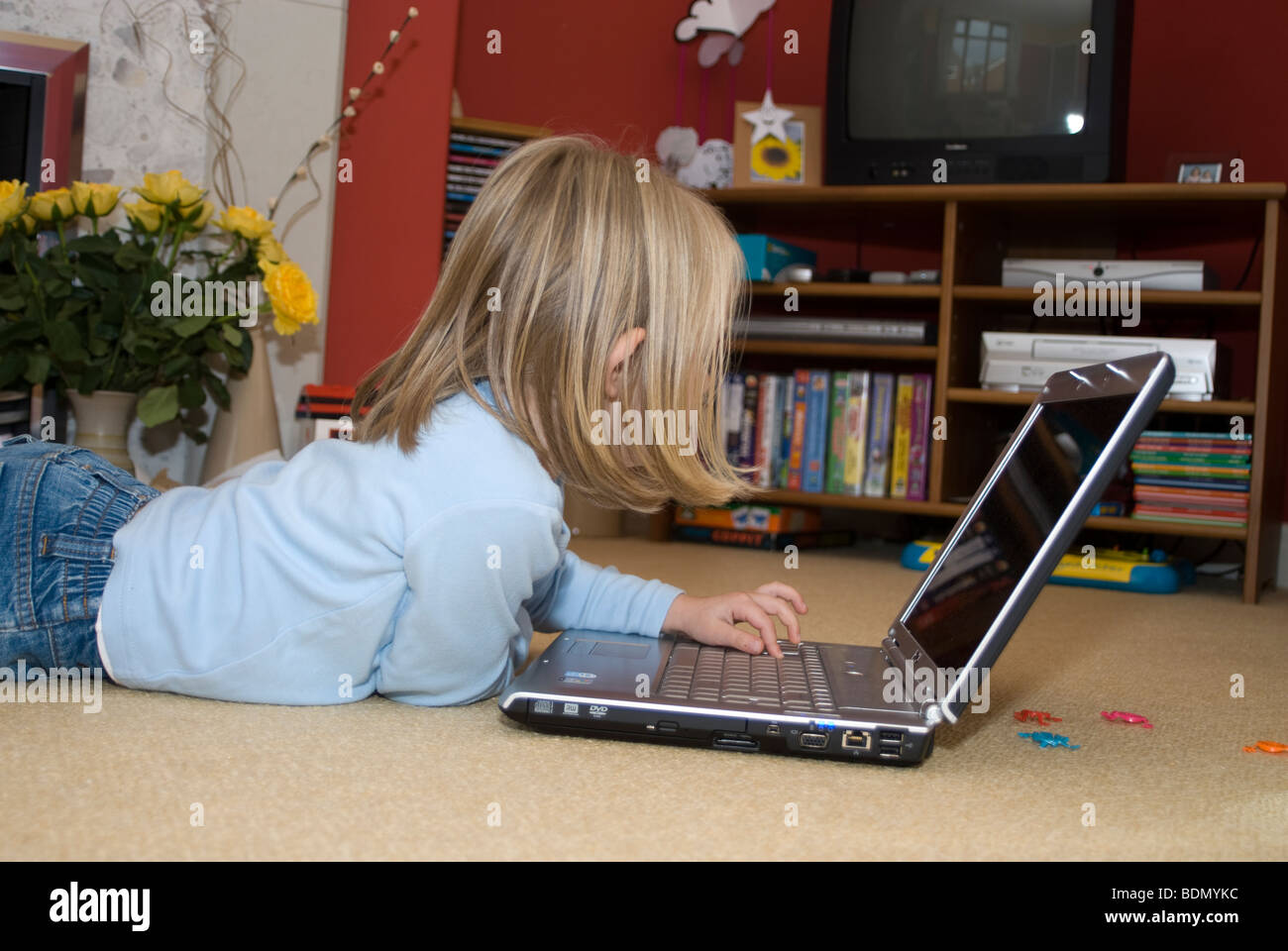 Toddler using laptop computer Stock Photo - Alamy