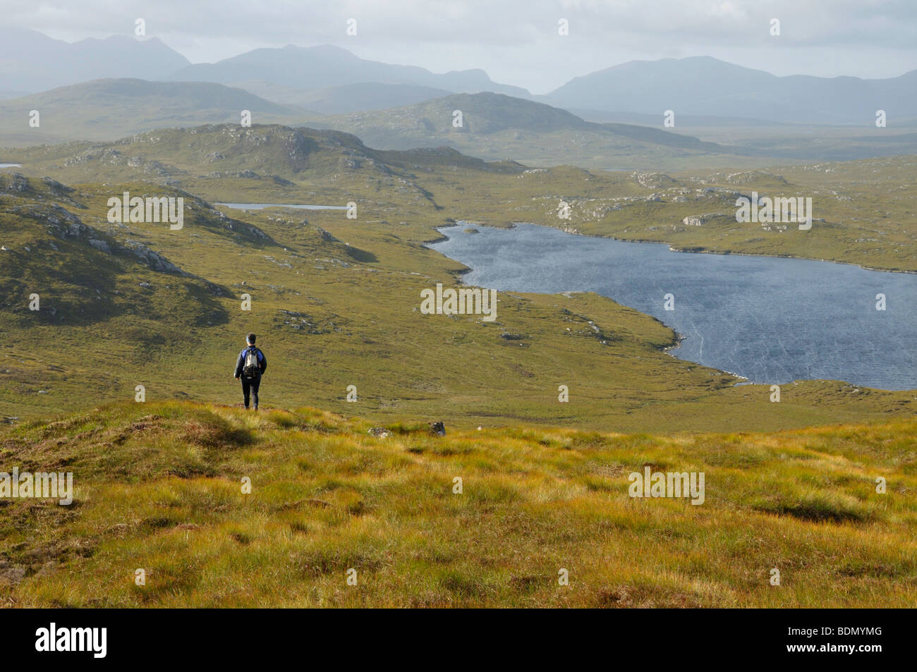 Walker descending south from Conostom, Isle of Lewis, Scotland Stock ...