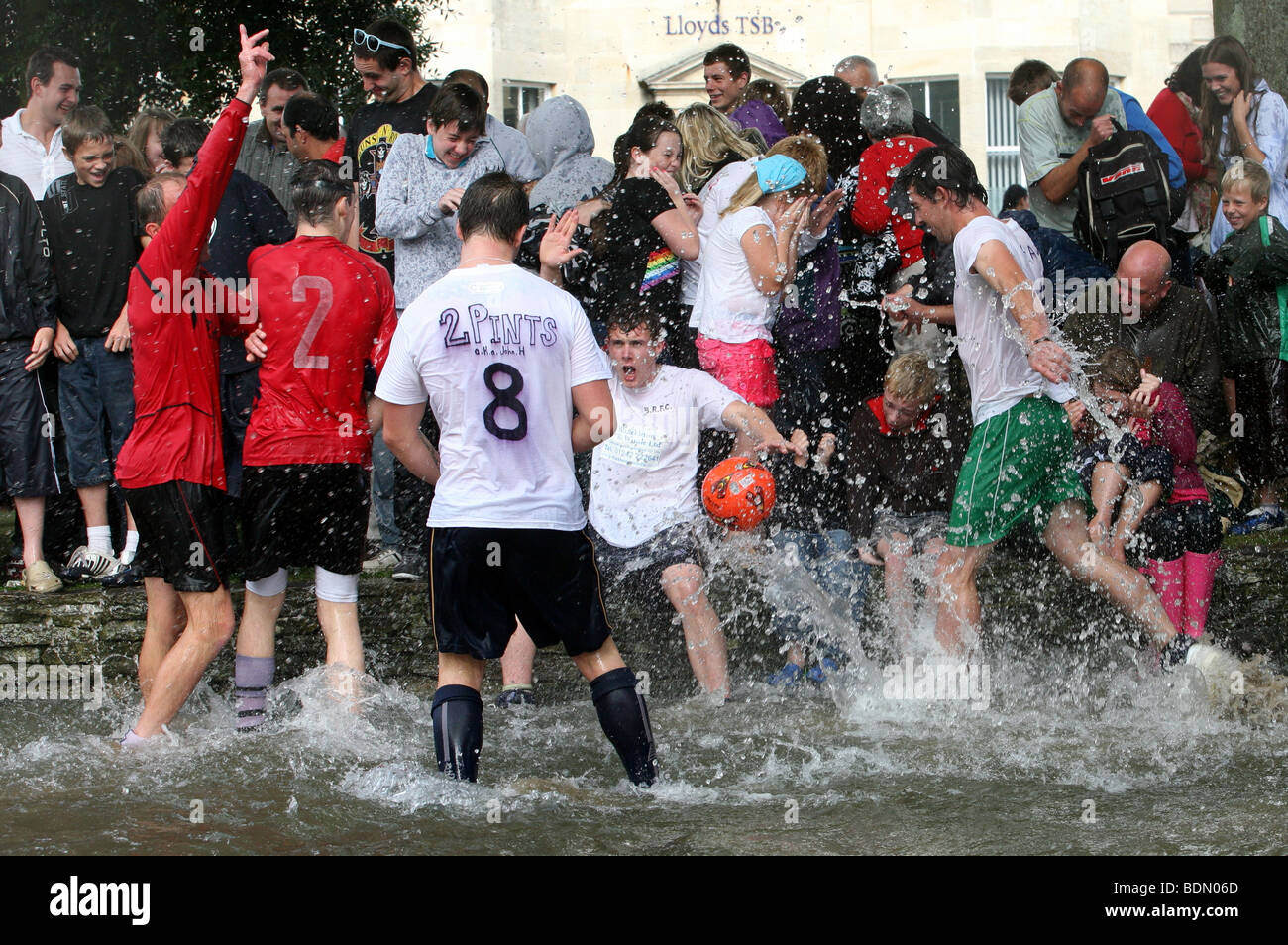 The annual football match held in The River Windrush Bourton on the ...