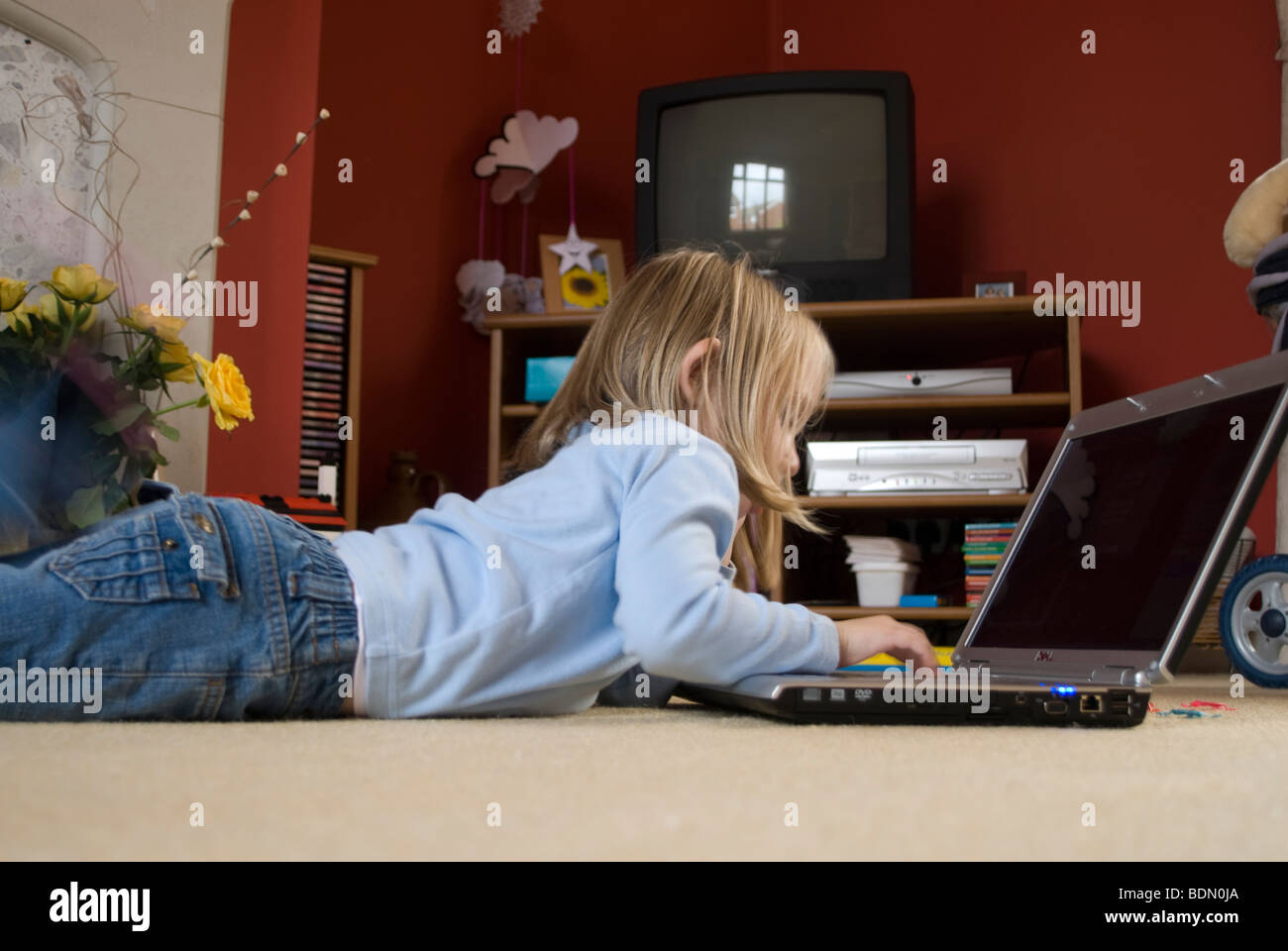 Toddler using laptop computer Stock Photo - Alamy