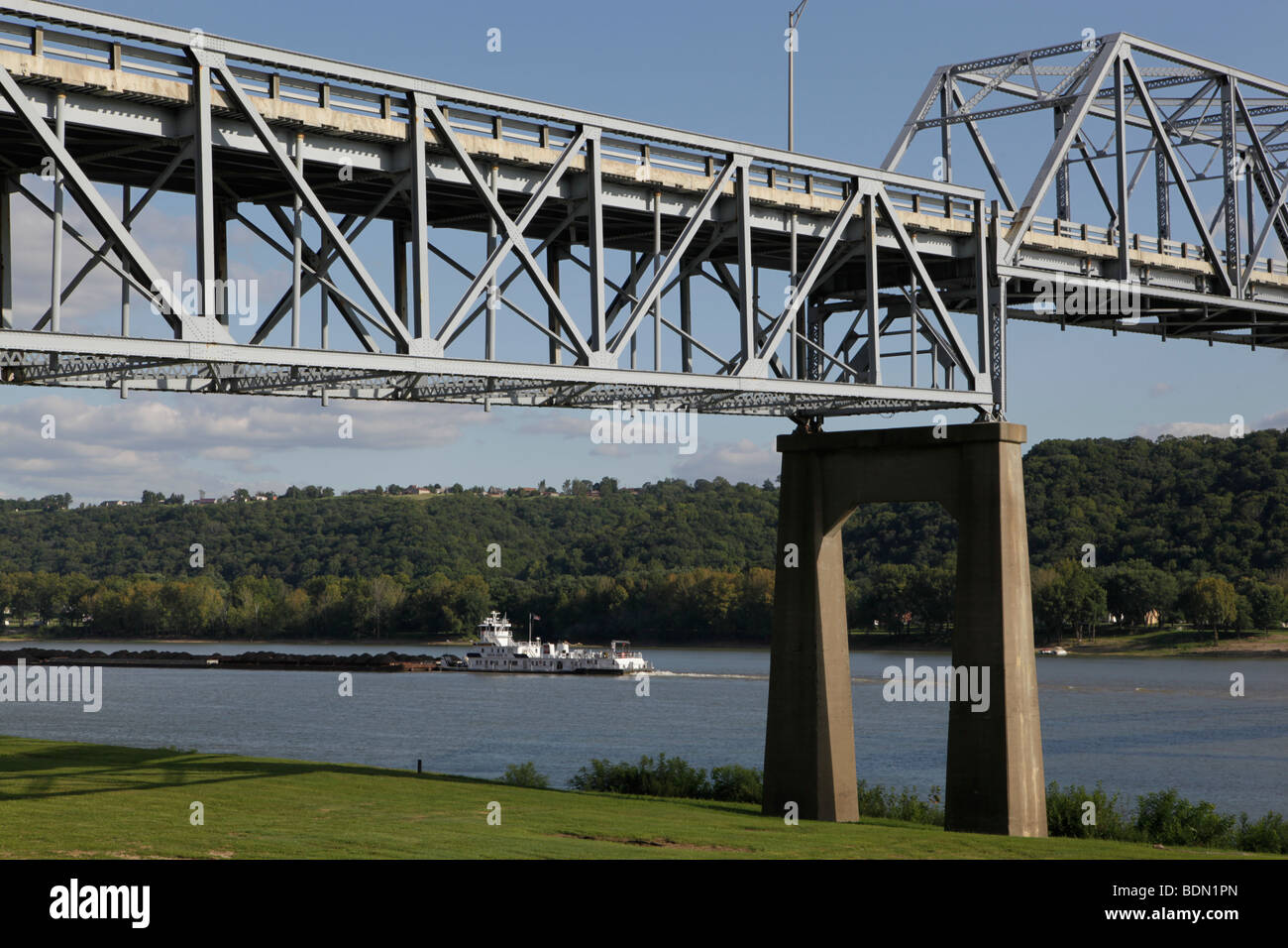 A coal barge moves upstream where the Madison-Milton Bridge crosses the ...