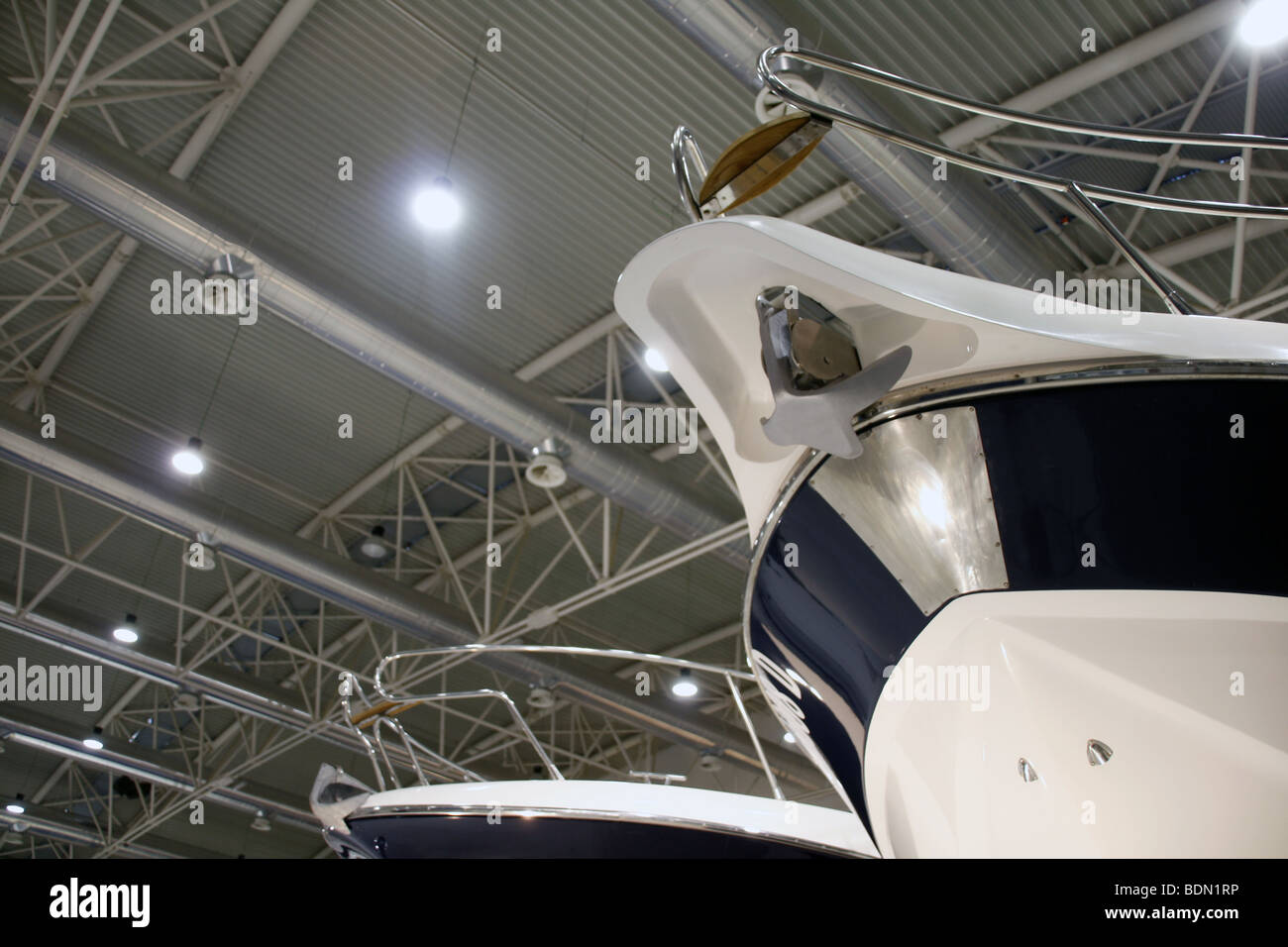 sea vessels at boat show in exhibition hall Stock Photo - Alamy