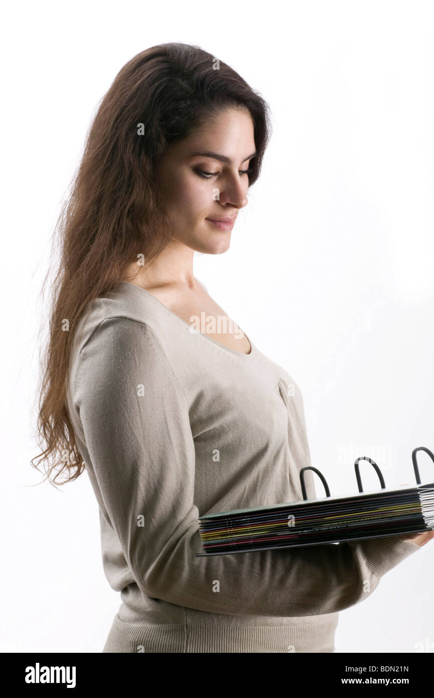 Girls looking at a file Stock Photo - Alamy