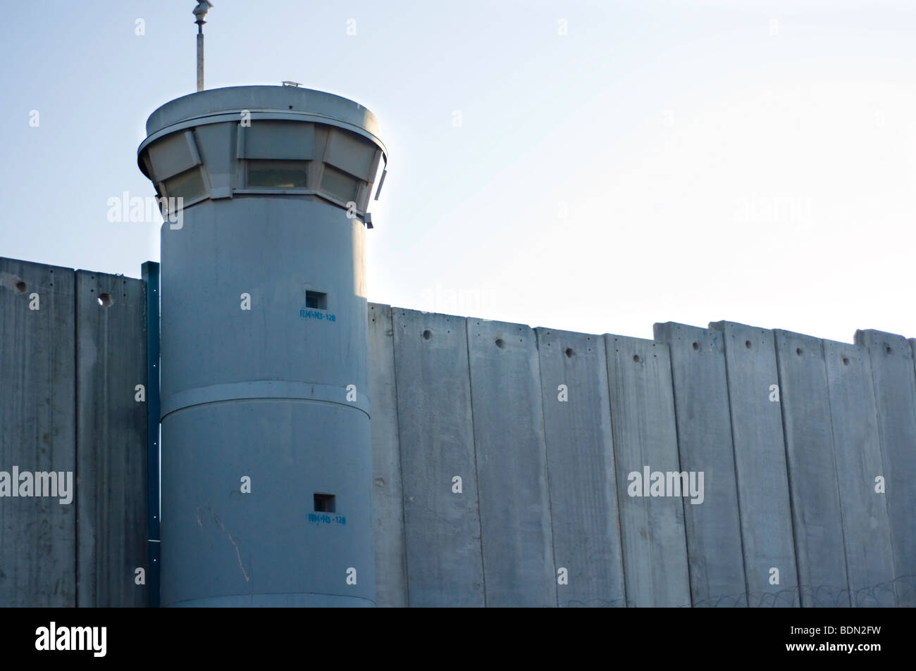 The Israeli separation wall divides West Bank Palestinian lands near ...