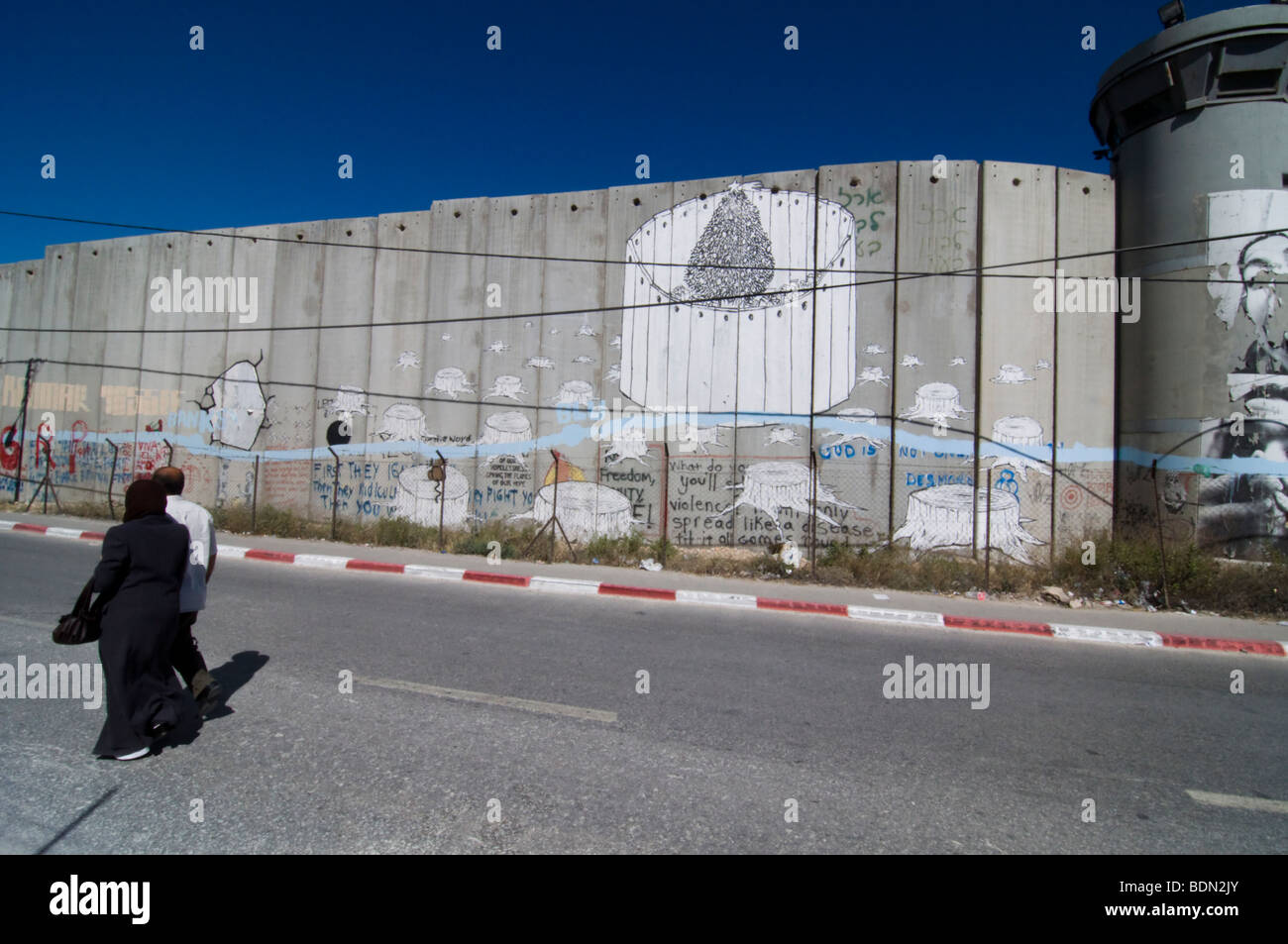 The Israeli separation wall juts into the Palestinian West Bank town of ...