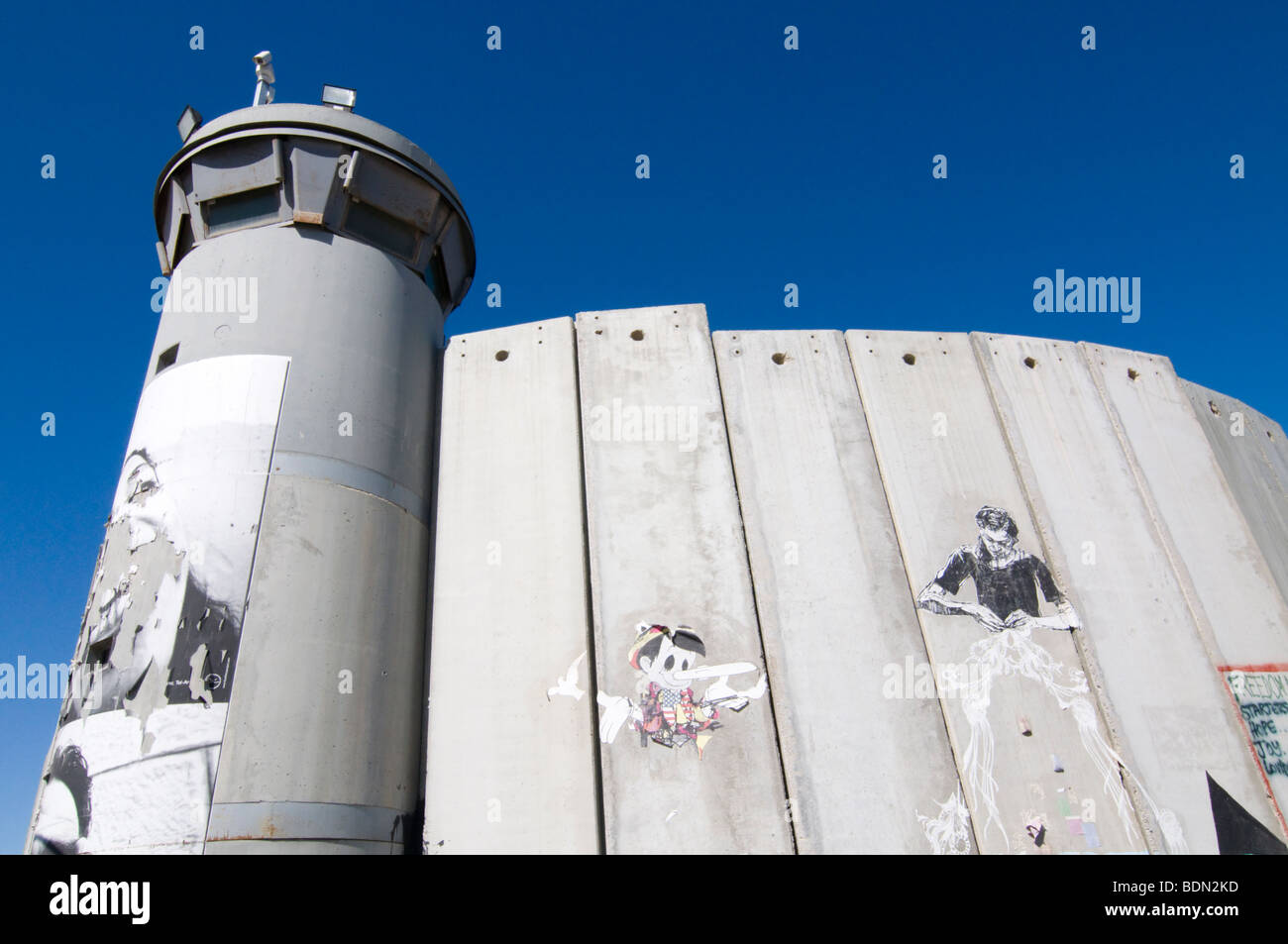 The Israeli separation wall juts into the Palestinian West Bank town of ...