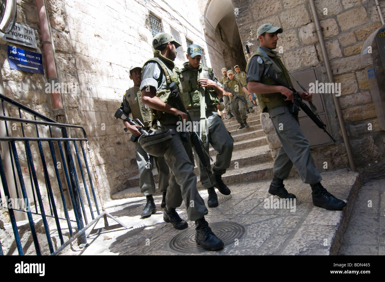 Israeli soldiers armed with automatic rifles patrol the Old City of ...