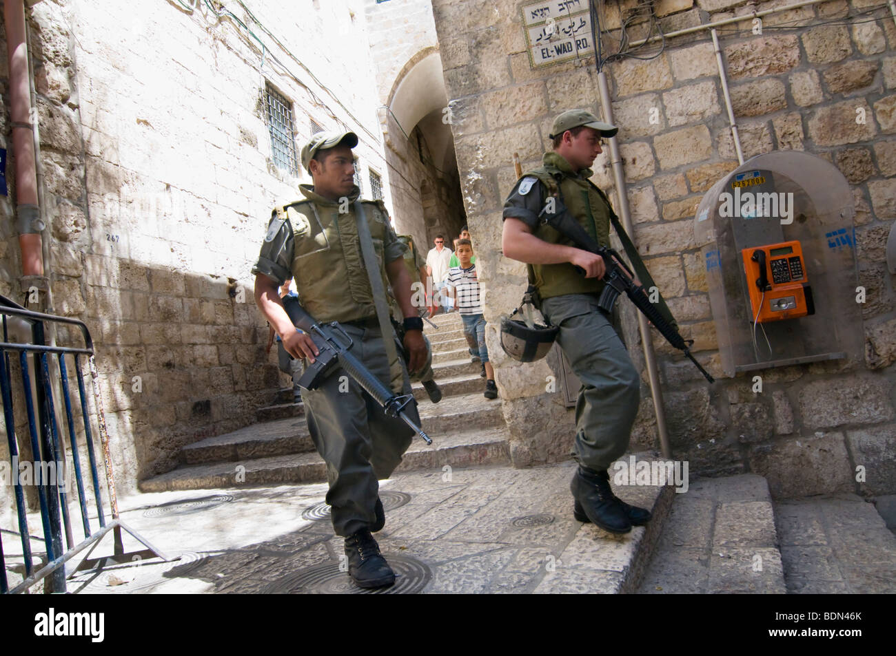 Israeli soldiers armed with automatic rifles patrol the Old City of ...