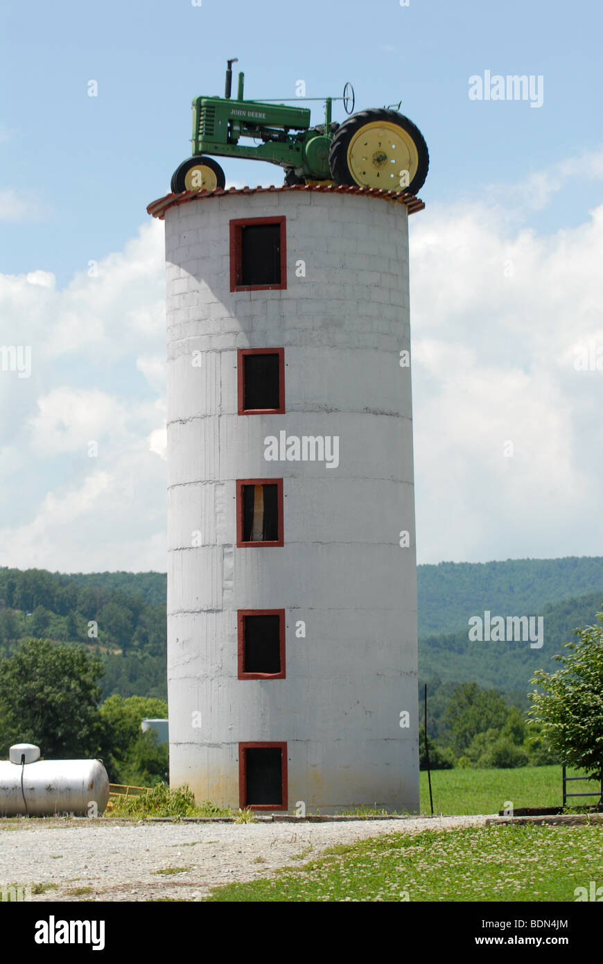 A John Deere tractor sits atop a silo in Hendersonville, N.C. at ...